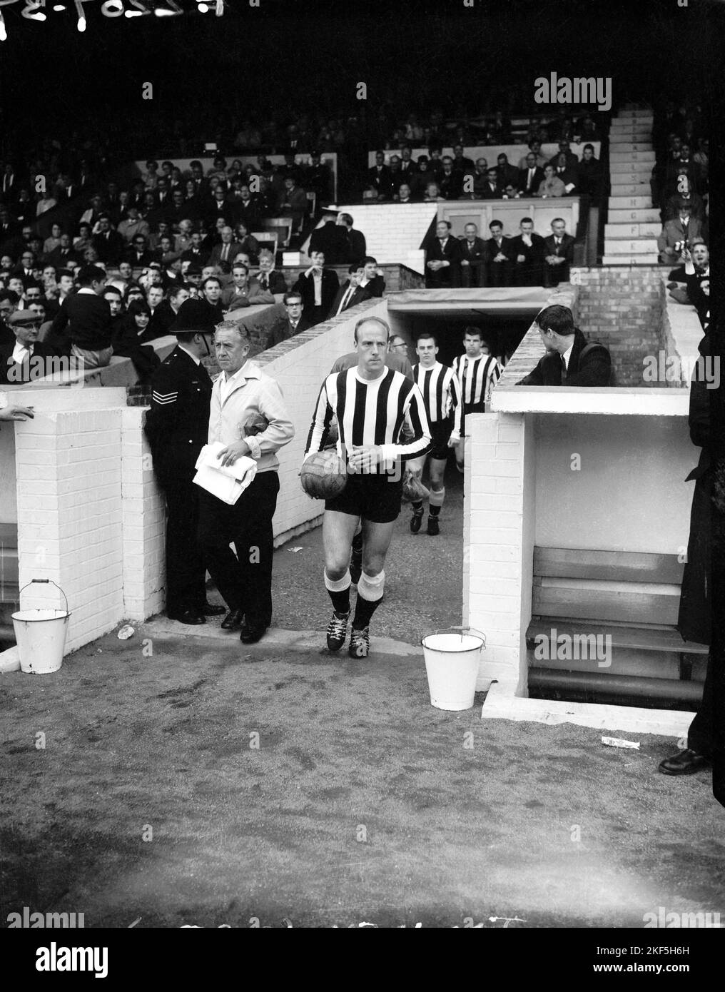 Newcastle United captain Jim Iley leads his team out before the match ...