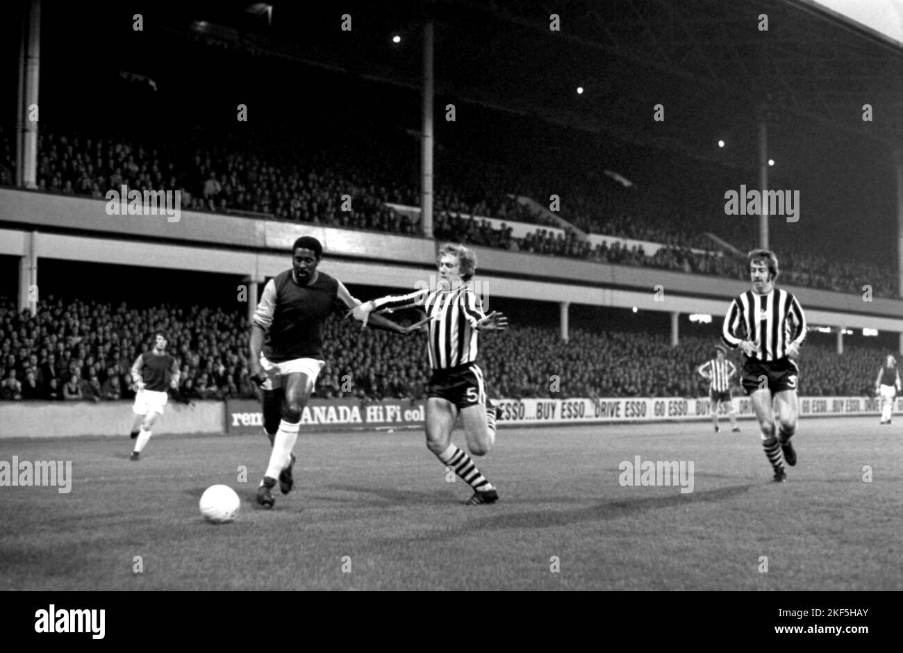 (L-R) West Ham United's Clyde Best takes on Newcastle United's Pat ...