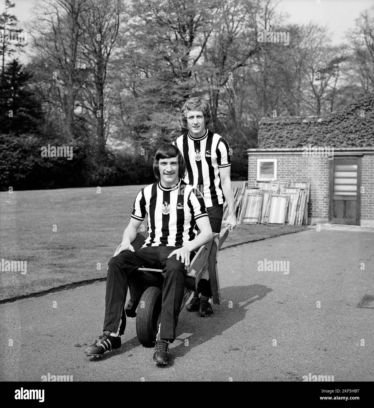 Newcastle United's Pat Howard (r) gives teammate Terry McDermott (l) a ...