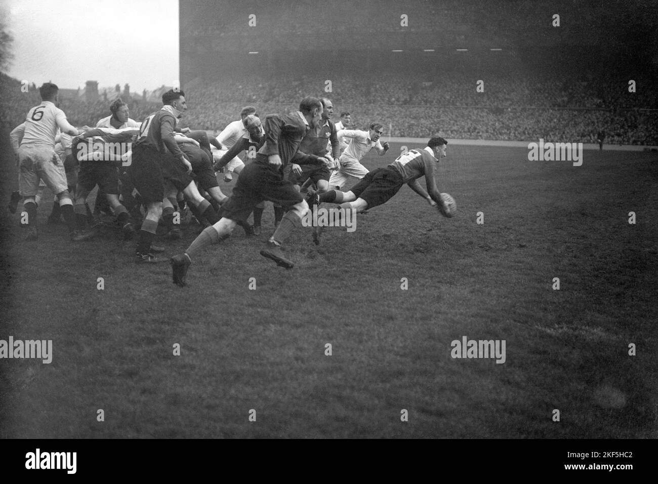 Haydn Tanner, the Welsh captain, makes a flying pass out of a scrum ...