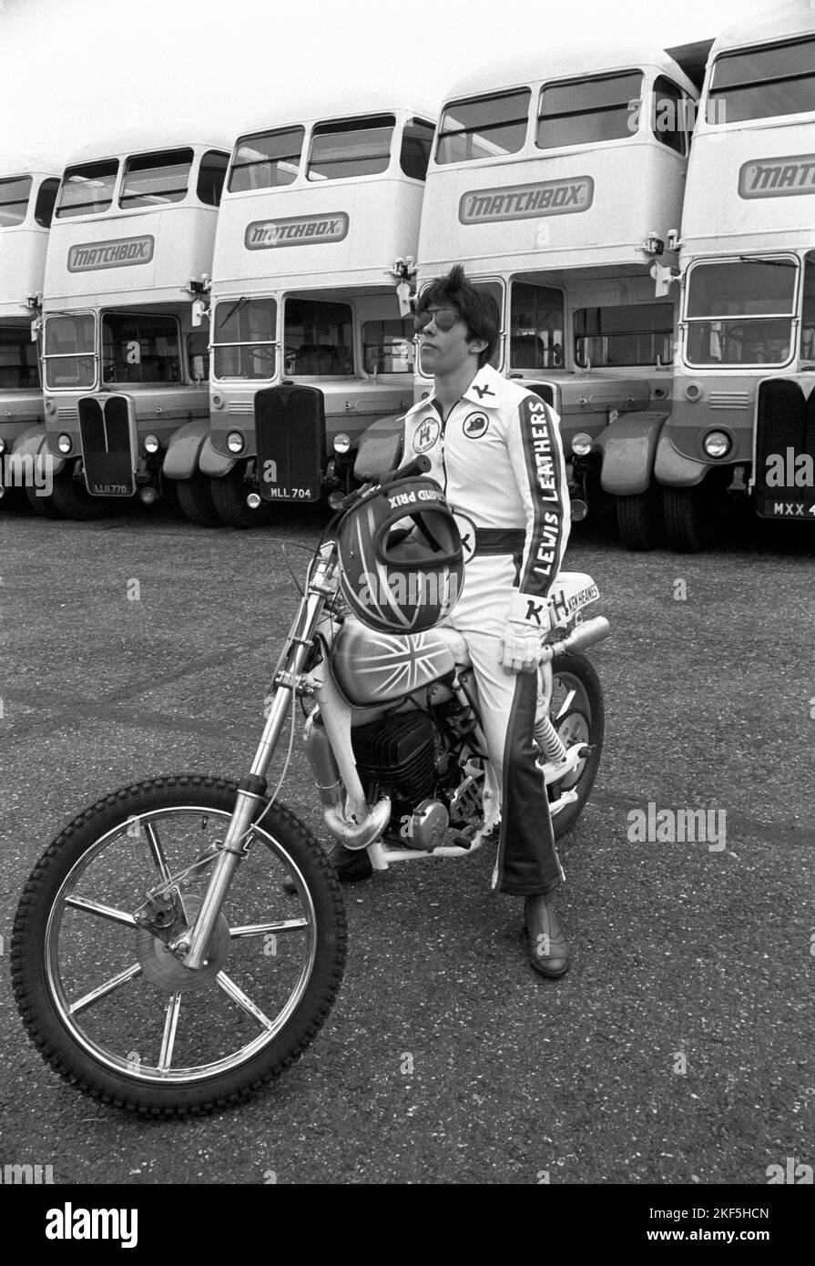 Eddie Kidd poses in front of the 14 double decker buses which he ...