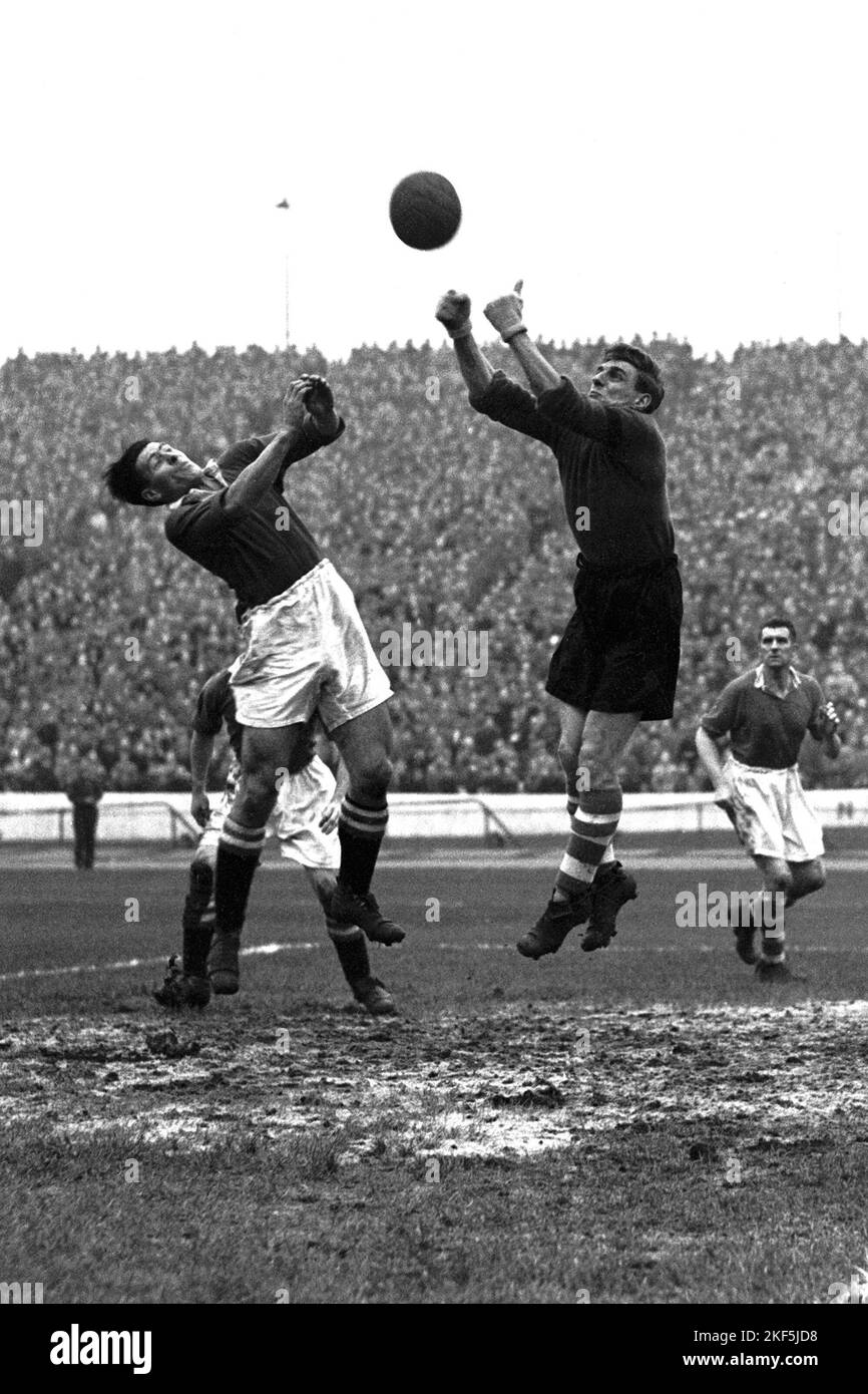 Liverpool goalkeeper Russell Crossley (r) punches clear from Chelsea's ...