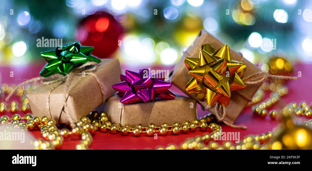 banner with Christmas gifts with blur Christmas balls and beads on ...