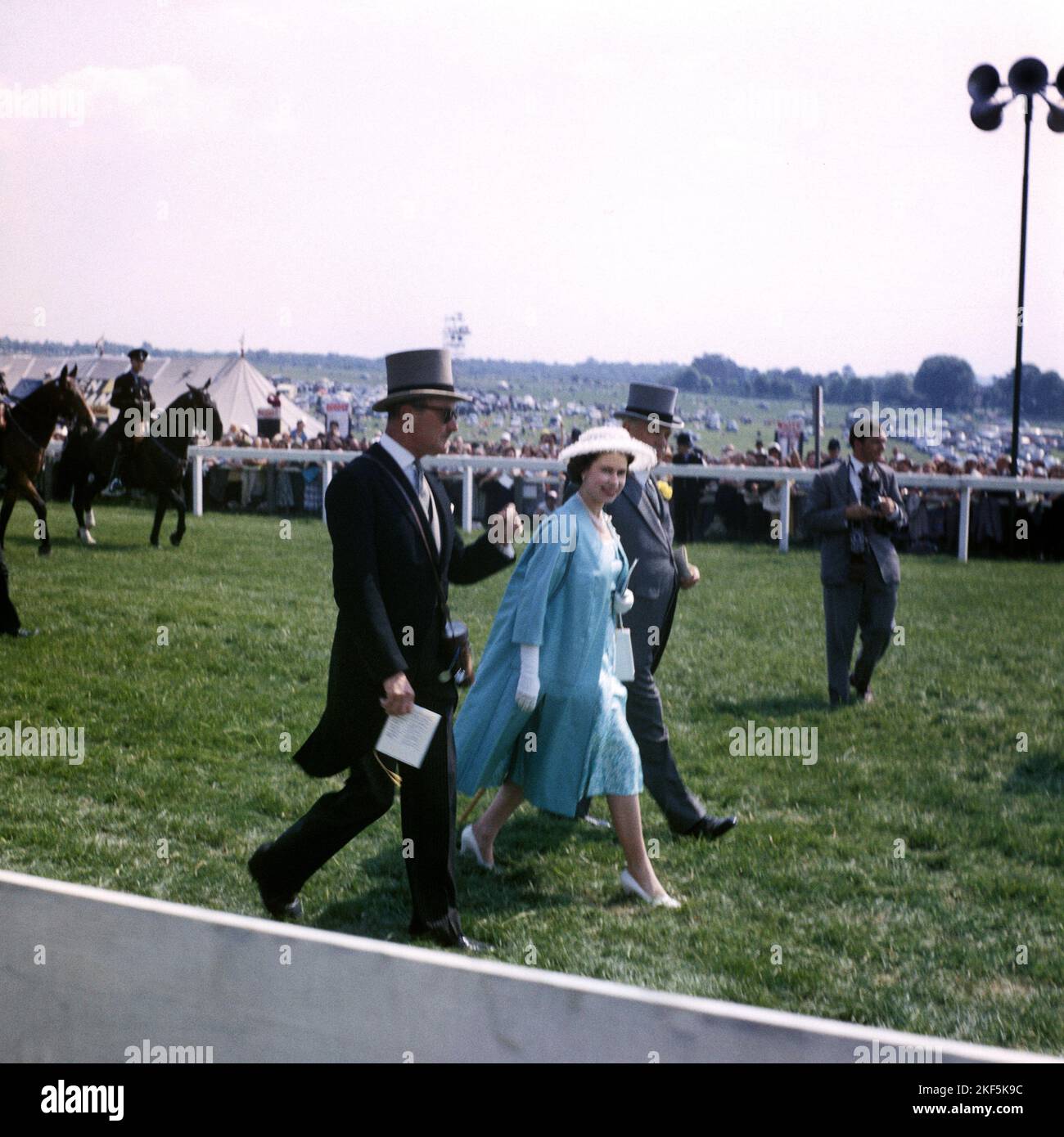 Queen Elizabeth II walking with Lord Roseberry Stock Photo - Alamy