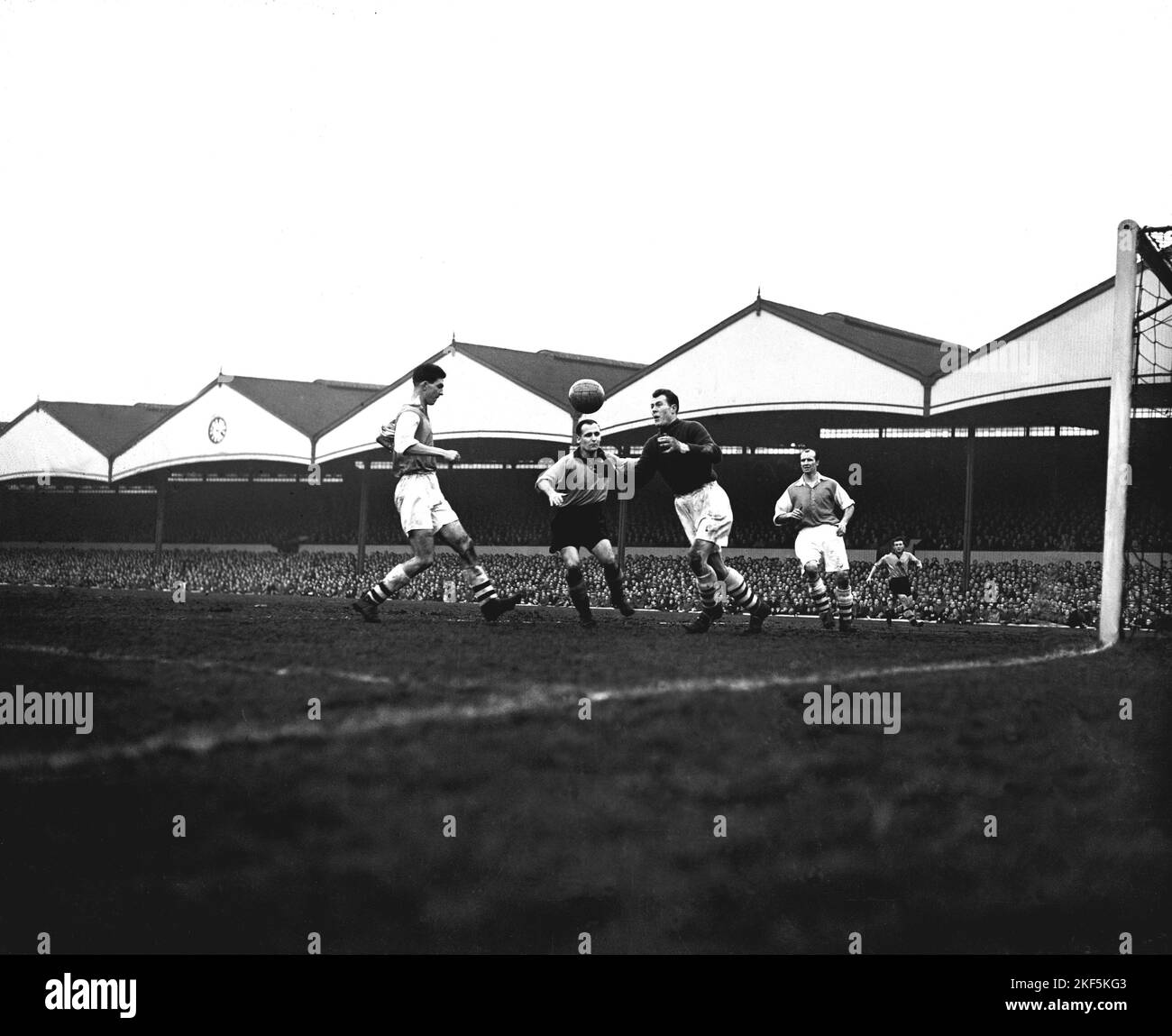 Arsenal goalkeeper Jack Kelsey (second r) comes out to grab the ball ...