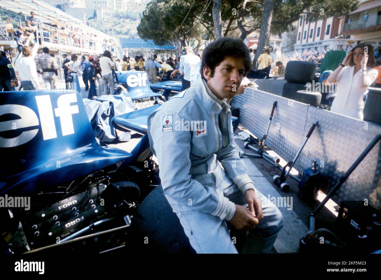 South African driver Jody Scheckter sits on the wheel of his Tyrrell ...