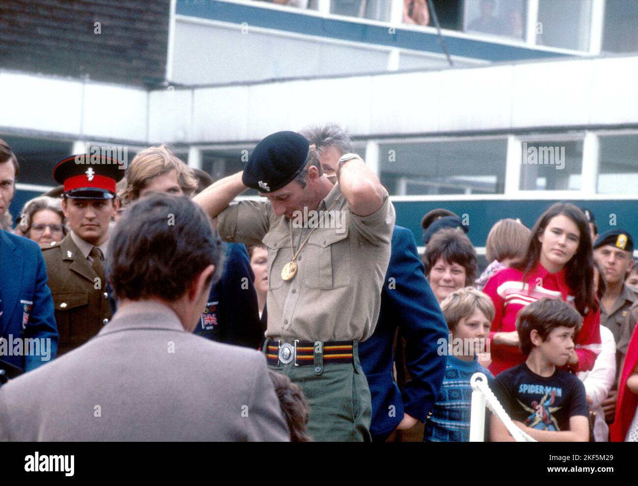 Olympic Modern Pentathlon gold medallist Jim Fox puts on his gold medal ...