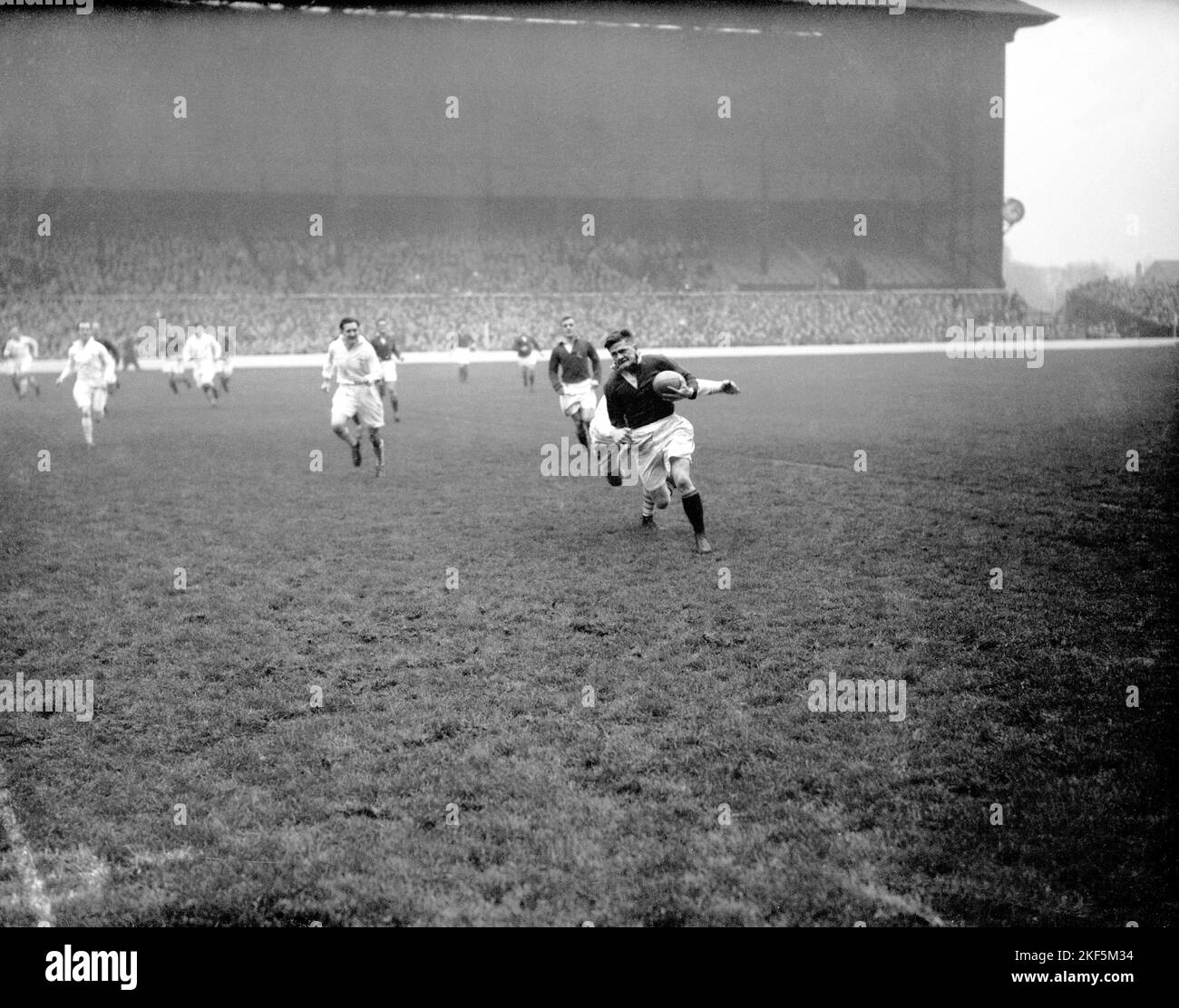 South Africa's Chum Ochse is tackled by London Counties' Albert Agar ...