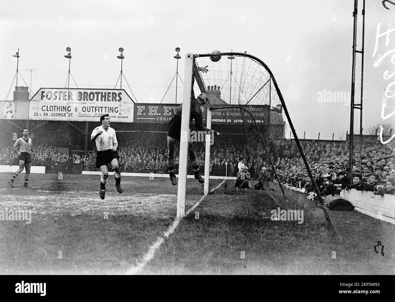 Wolverhampton Wanderers goalkeeper Malcolm Finlayson (r) tips the ball ...