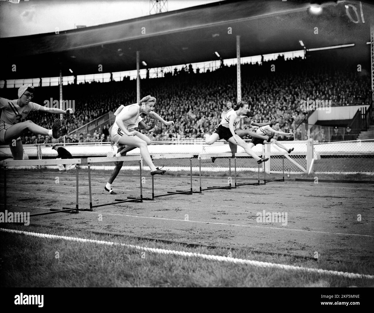 (L-R) The competitors in the women's 80m hurdles clear the first hurdle ...