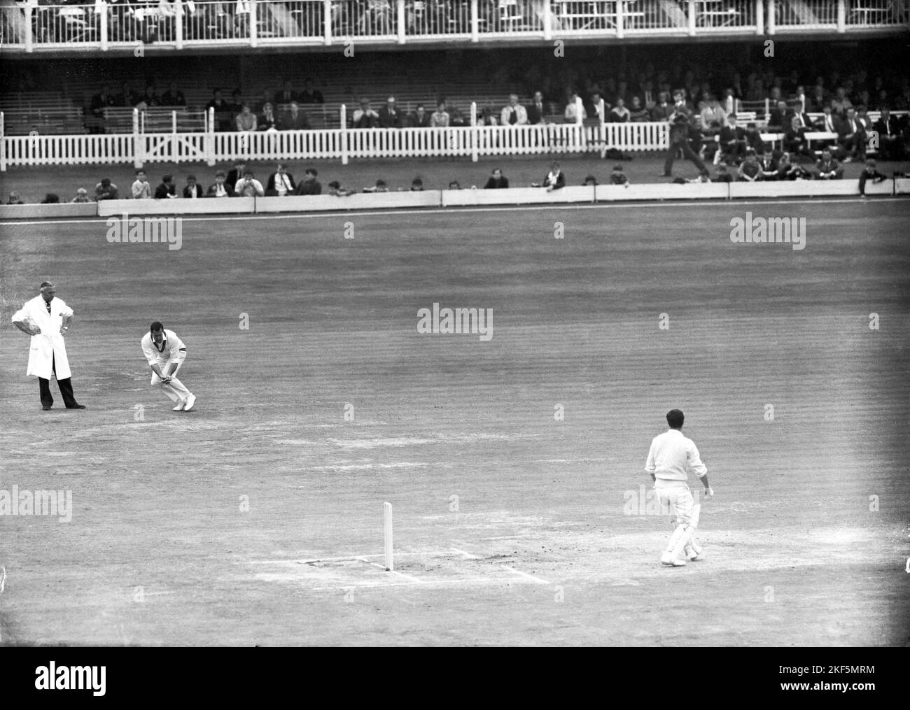 South Africa's Colin Bland (second l) stoops to field the ball Stock ...