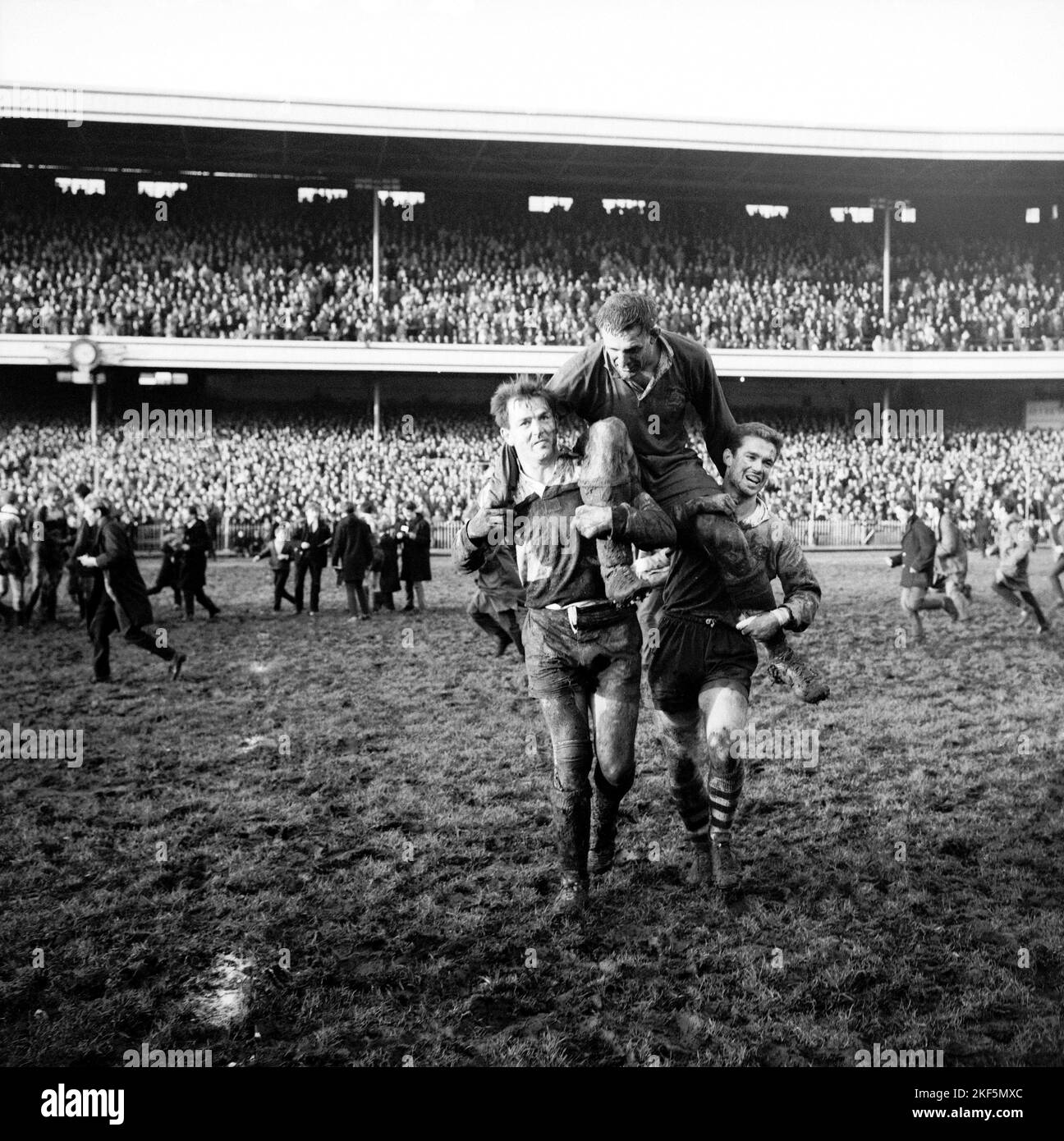 Australia captain John Thornett (c) is chaired off by teammate Phil ...