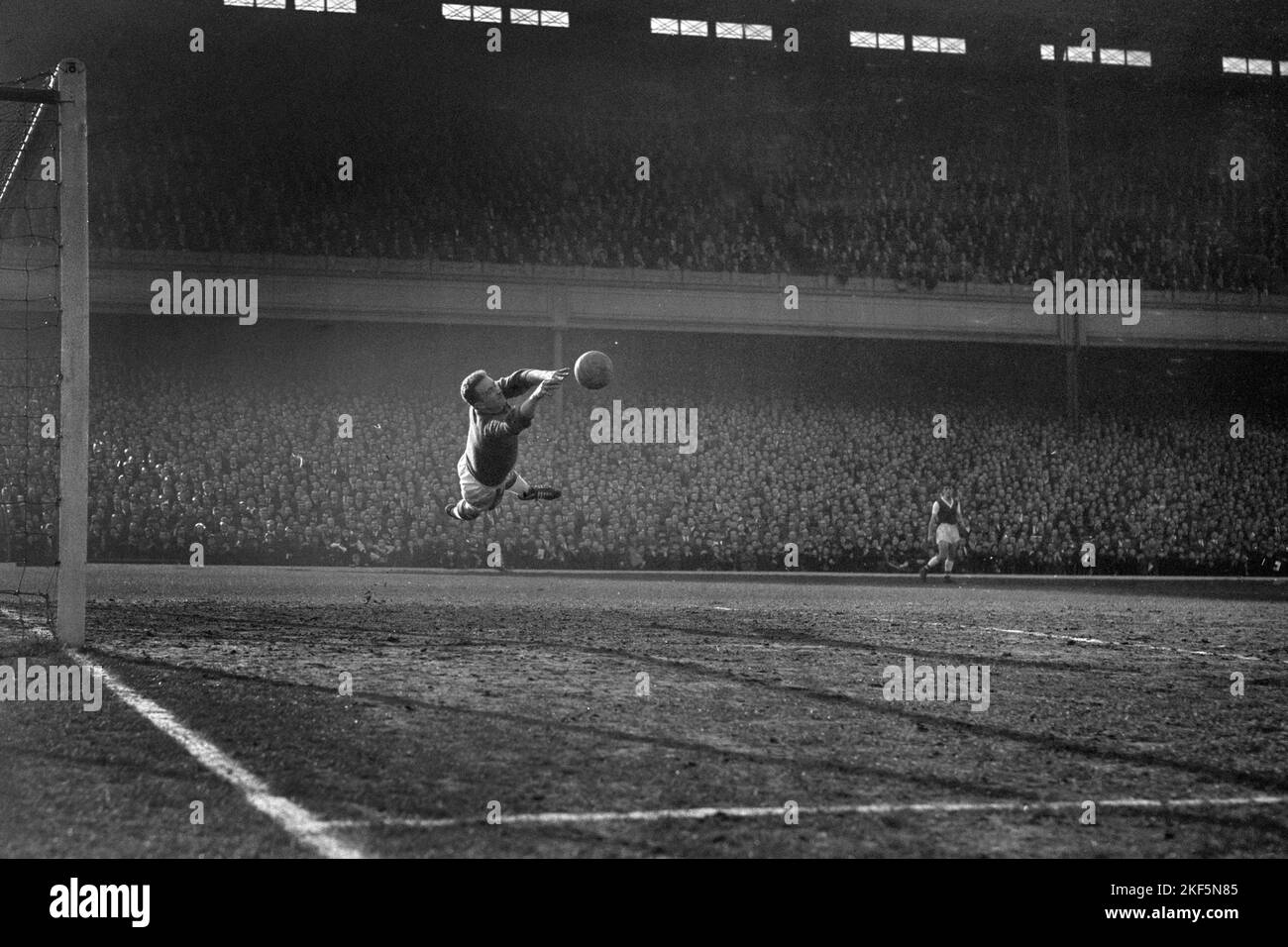 Manchester United goalkeeper Harry Gregg makes a flying save Stock ...