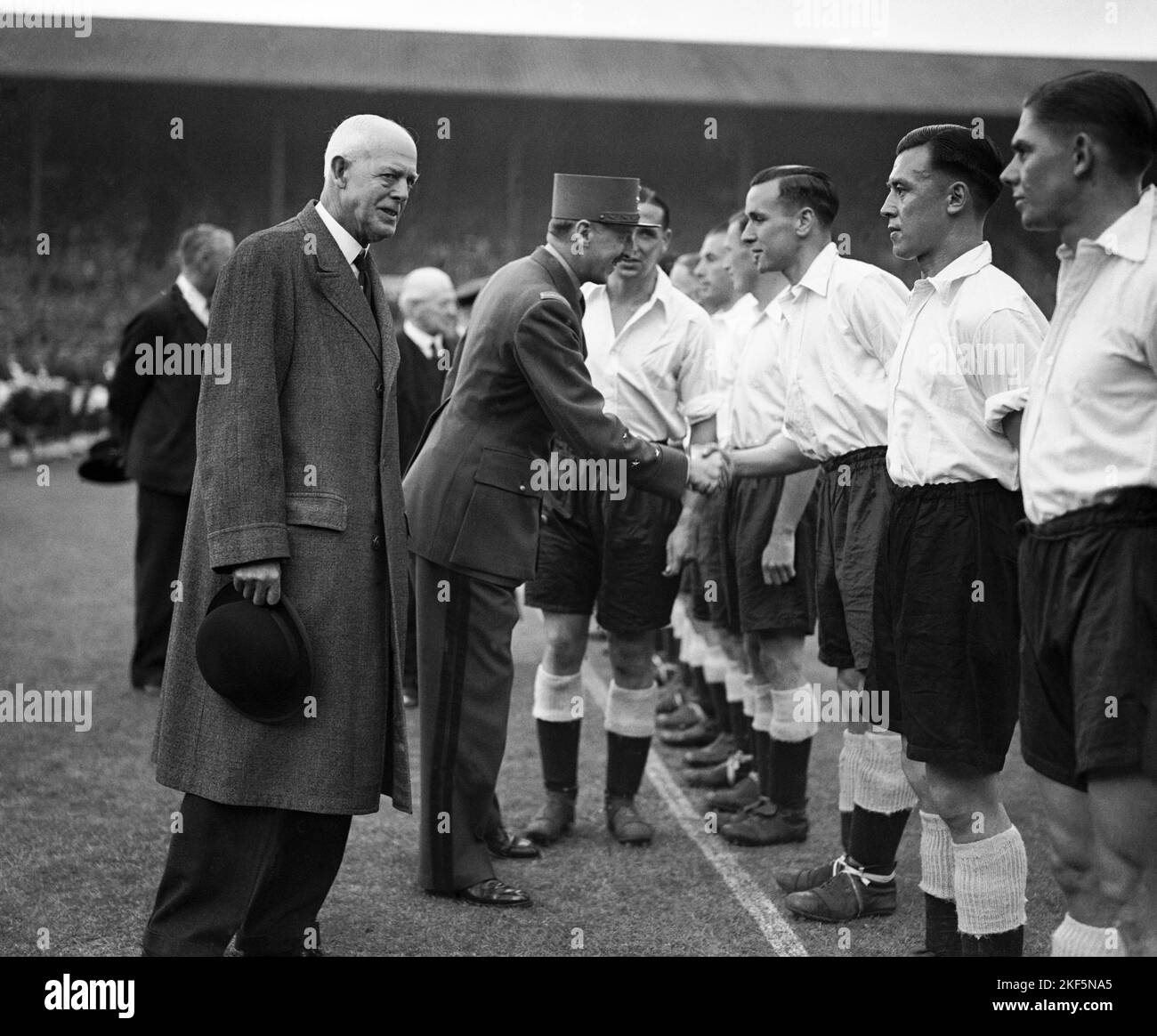 General Koenig, the French Governor of Paris, shaking hands with Neil ...