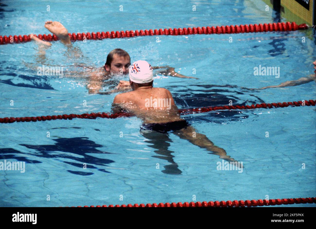 Great Britain's David Wilkie (bottom) congratulates USA's John Hencken ...