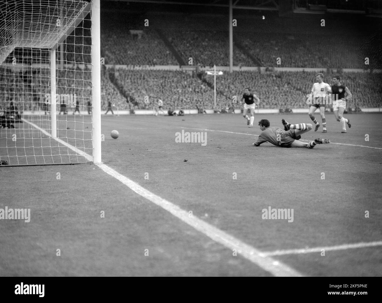 Preston North End goalkeeper Alan Kelly dives in vain to stop the ...