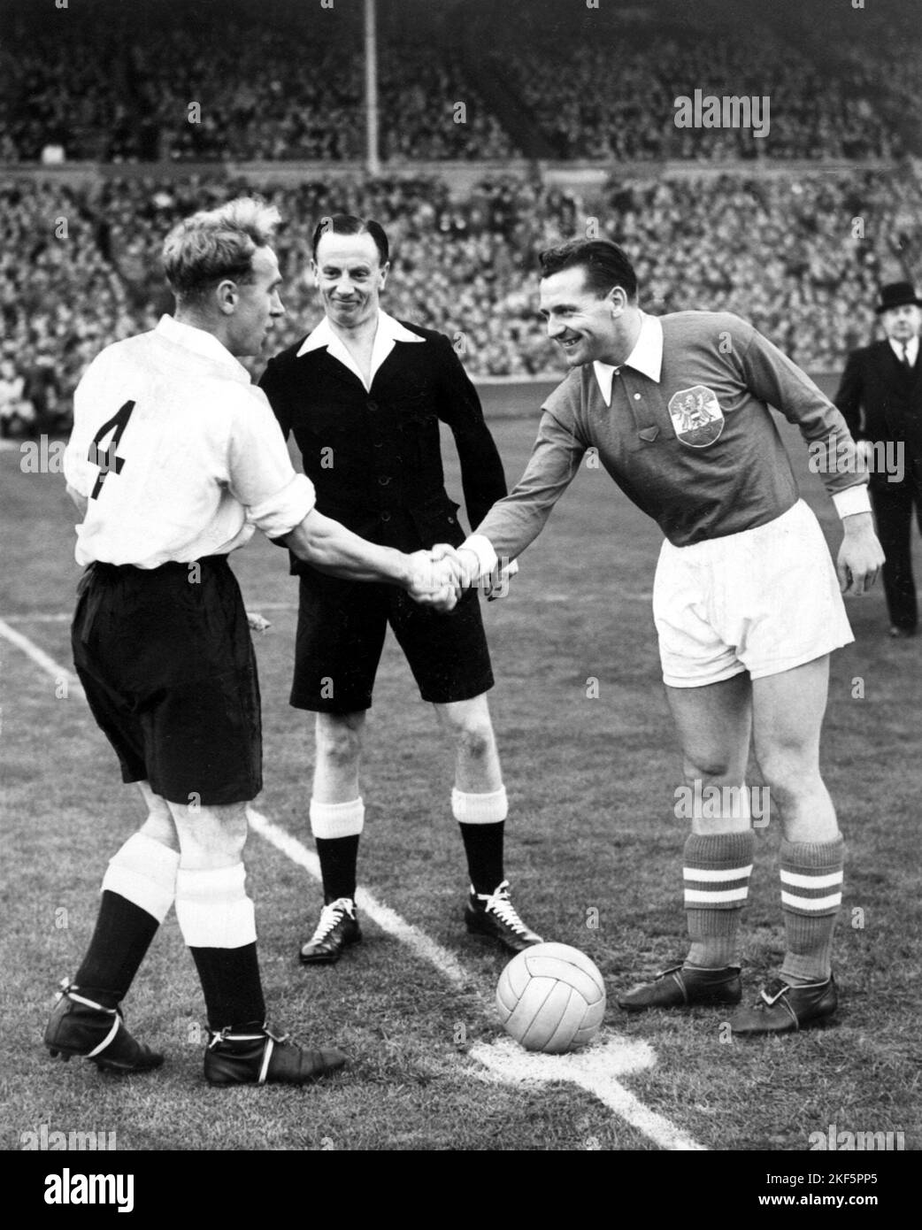 England captain Billy Wright (l) shakes hands with Austria captain ...