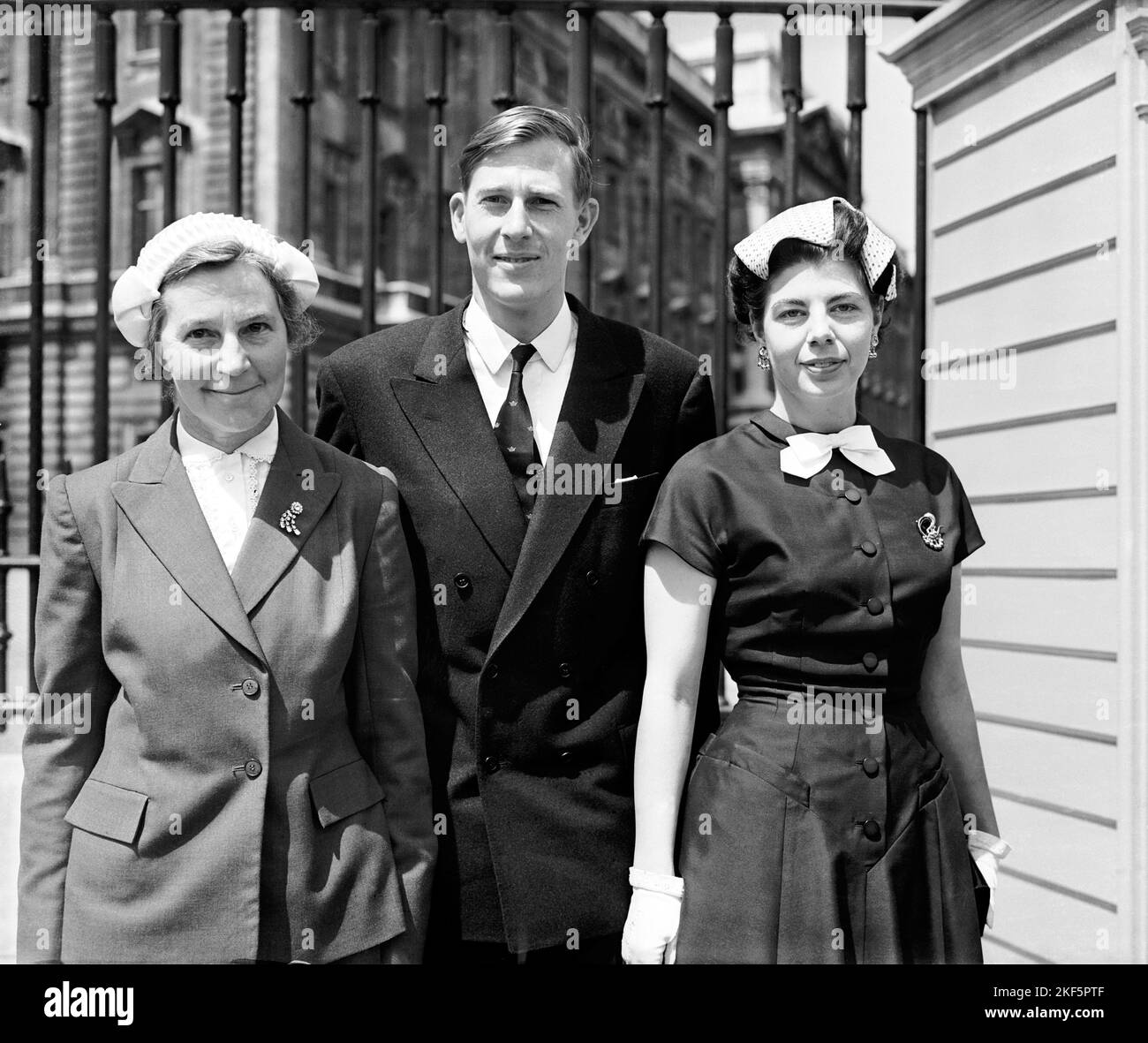 Dr Roger Bannister (c) leaves Buckingham Palace with his wife Moyra (r ...