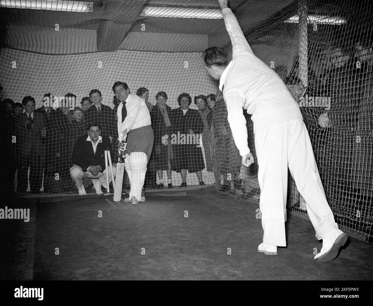 Comedian Tony Hancock faces some bowling by top cricketer Frank Tyson ...