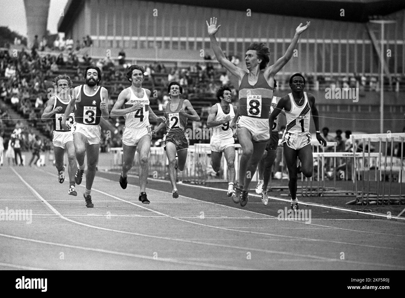 David Moorcroft (8) celebrates wildly as he breaks the tape to win from ...