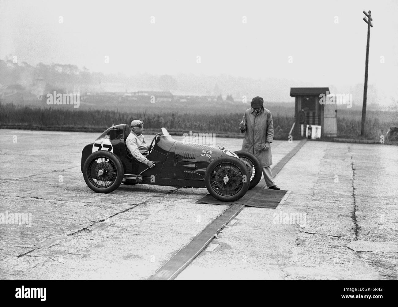 Bert Hadley prepares to release the handbrake on his Austin to begin ...