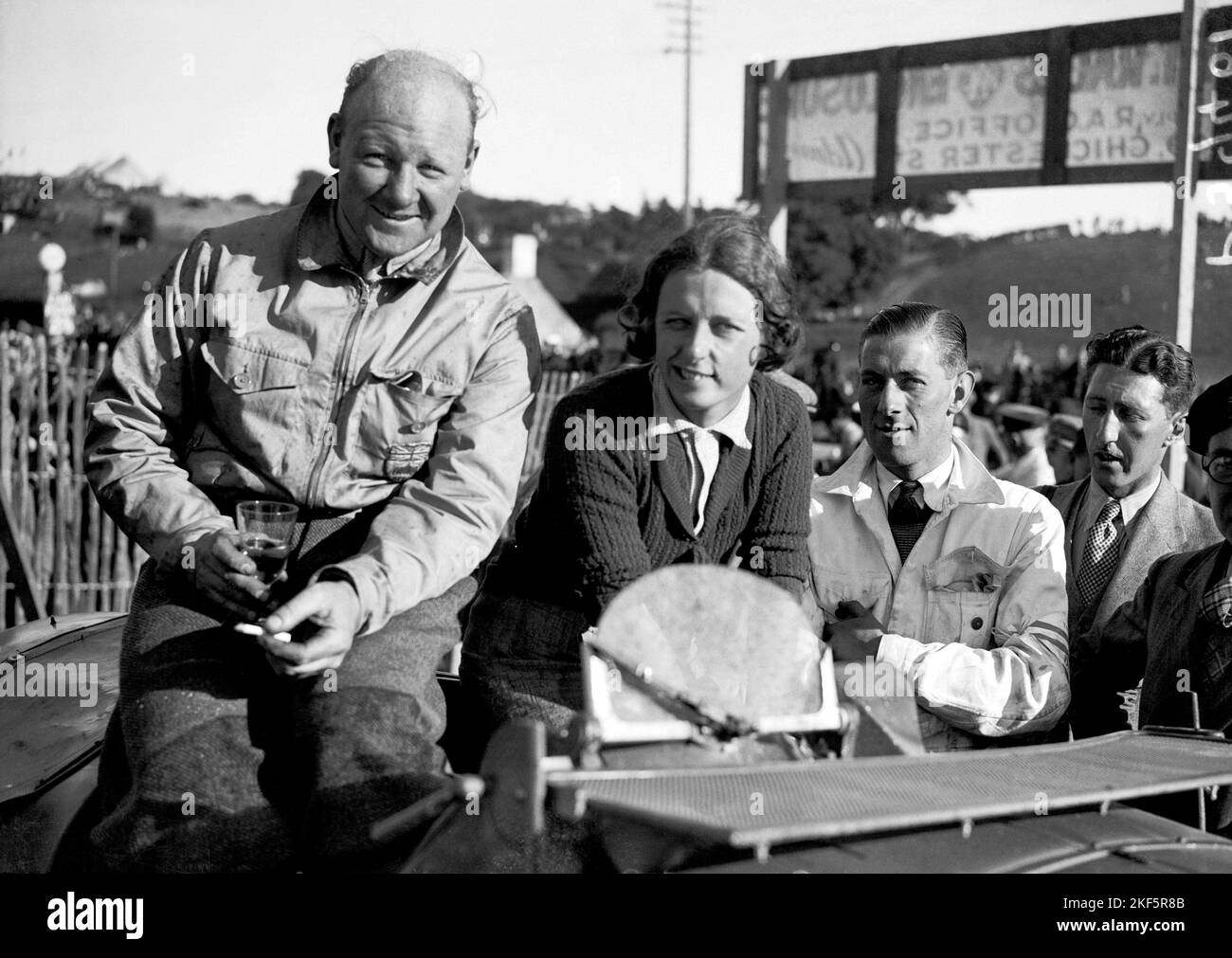 Racing driver ER Hall enjoys a brandy and a cigarette in the company of ...