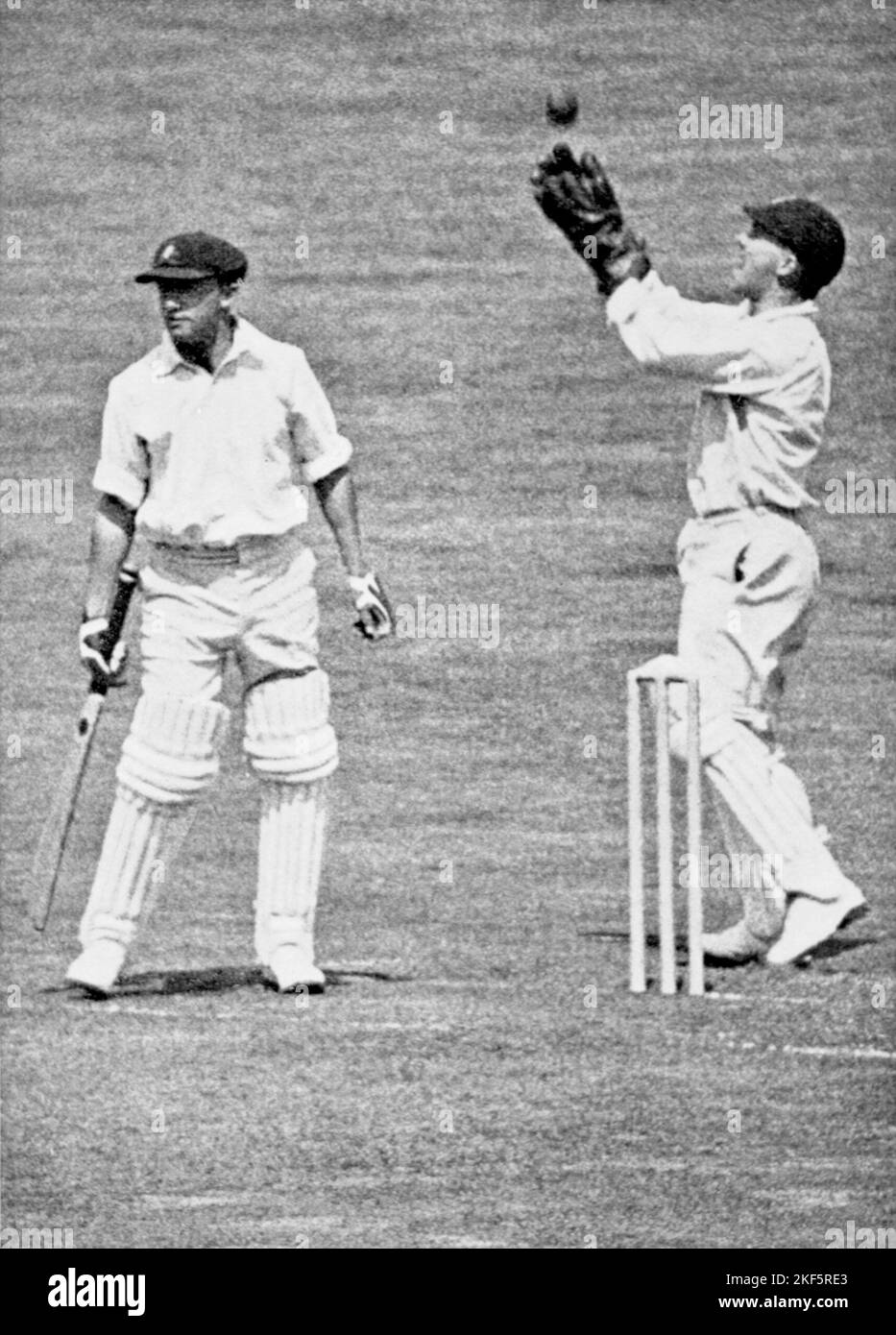 England wicketkeeper George Duckworth (r) celebrates after catching ...