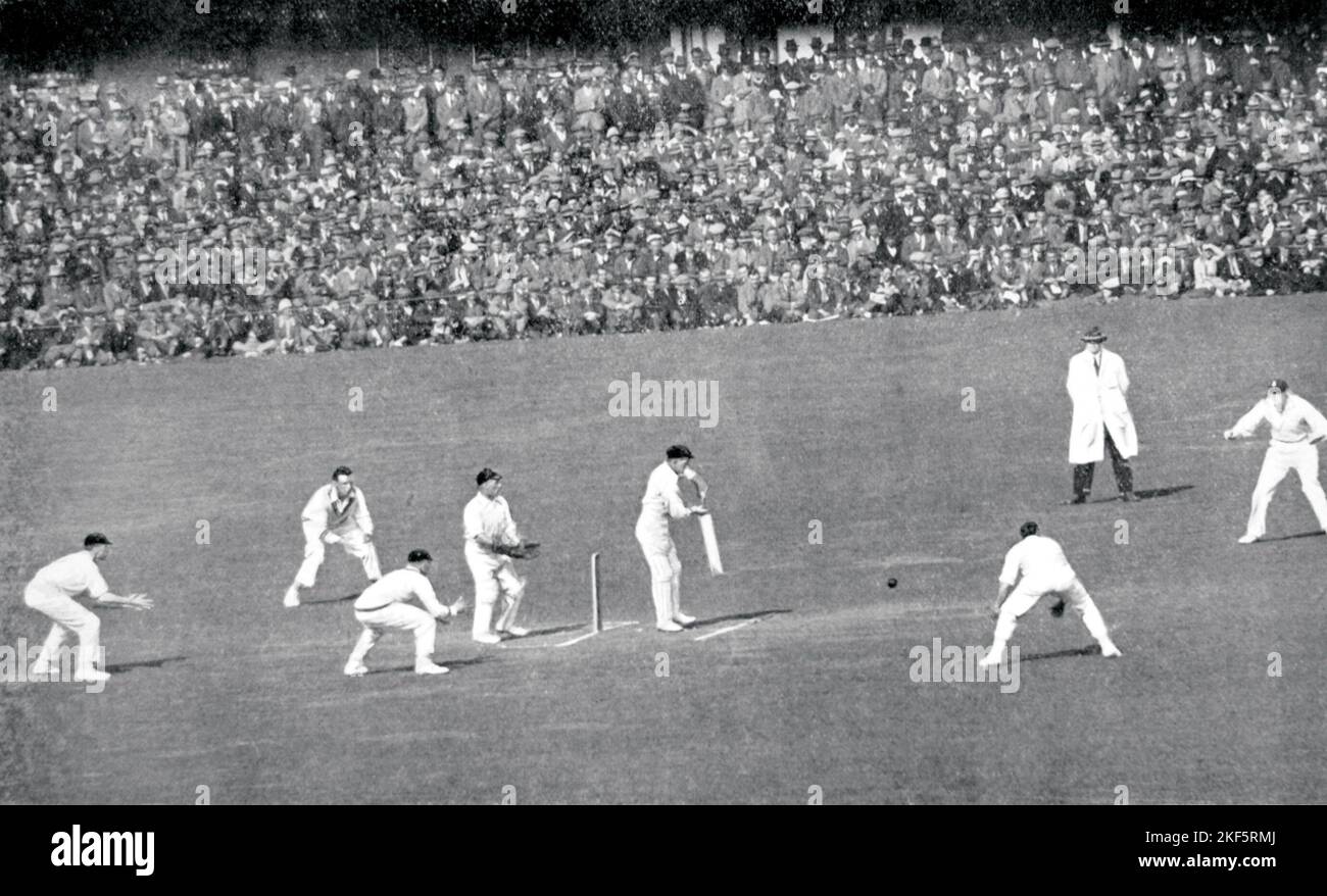 Australia's Herbie Collins (third r) plays a defensive stroke, watched ...