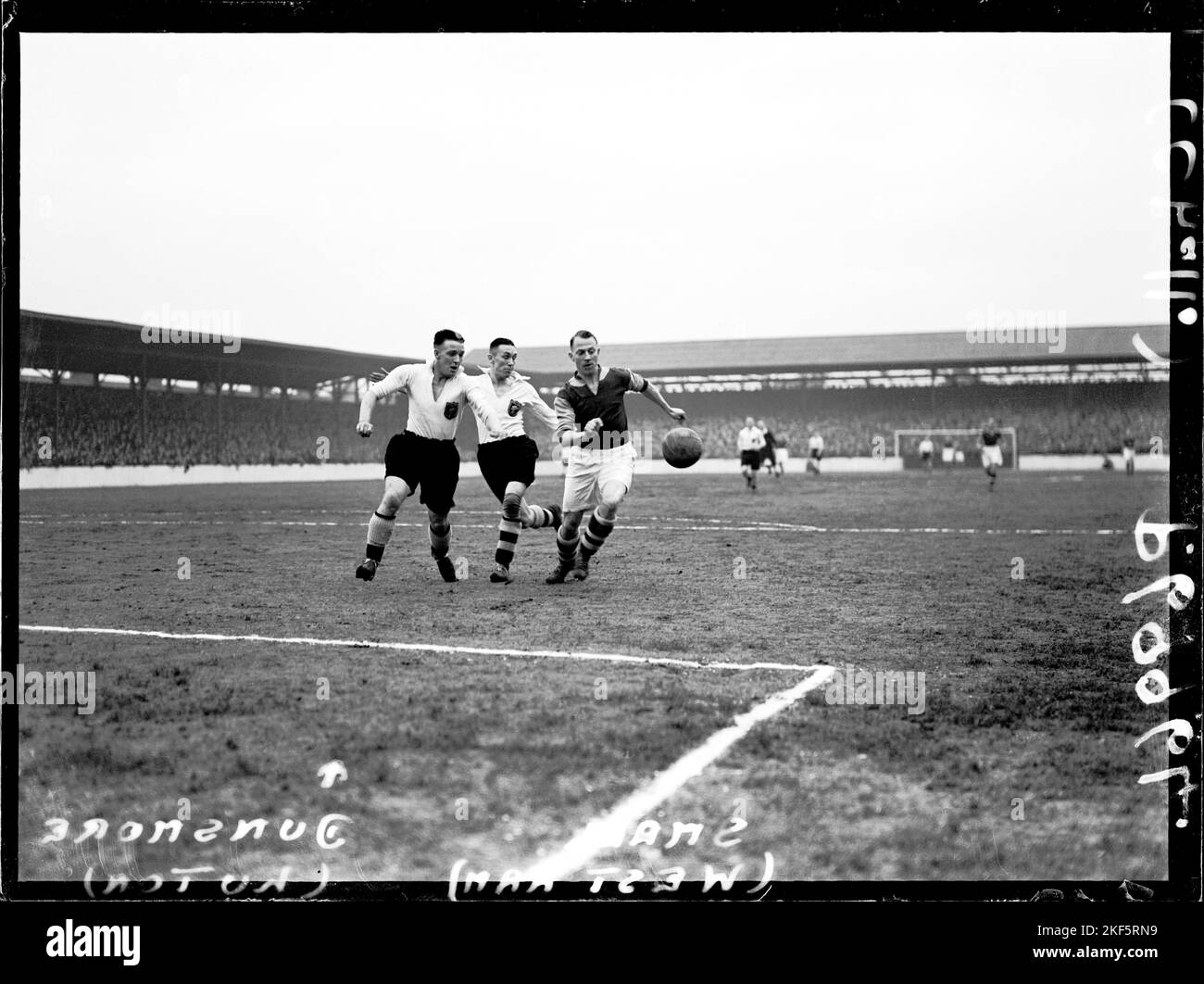 West Ham United's Sam Small (r) is pursued by Luton Town's Tom Dunsmore ...
