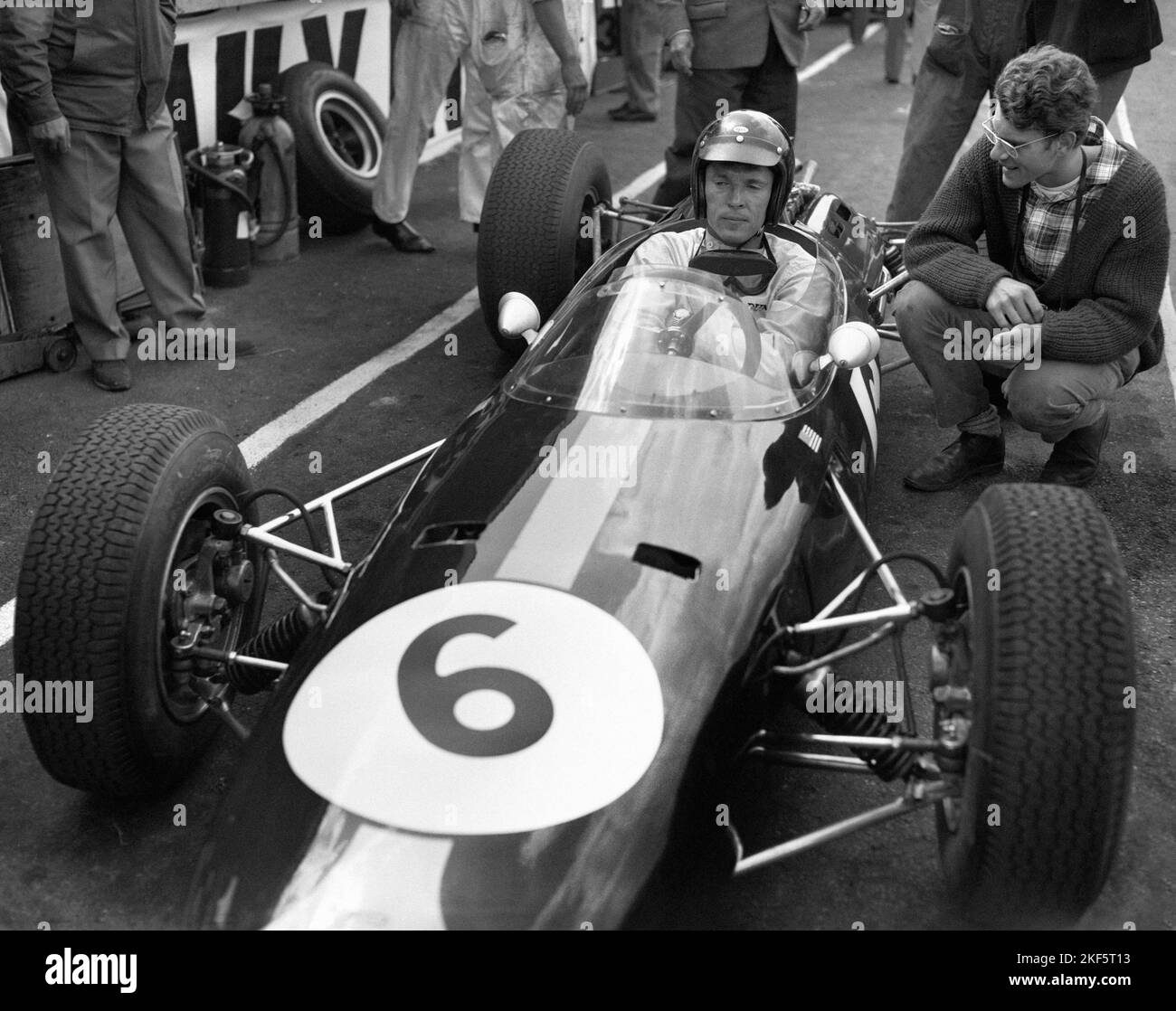 Dan Gurney seated in his Brabham Climax Stock Photo - Alamy