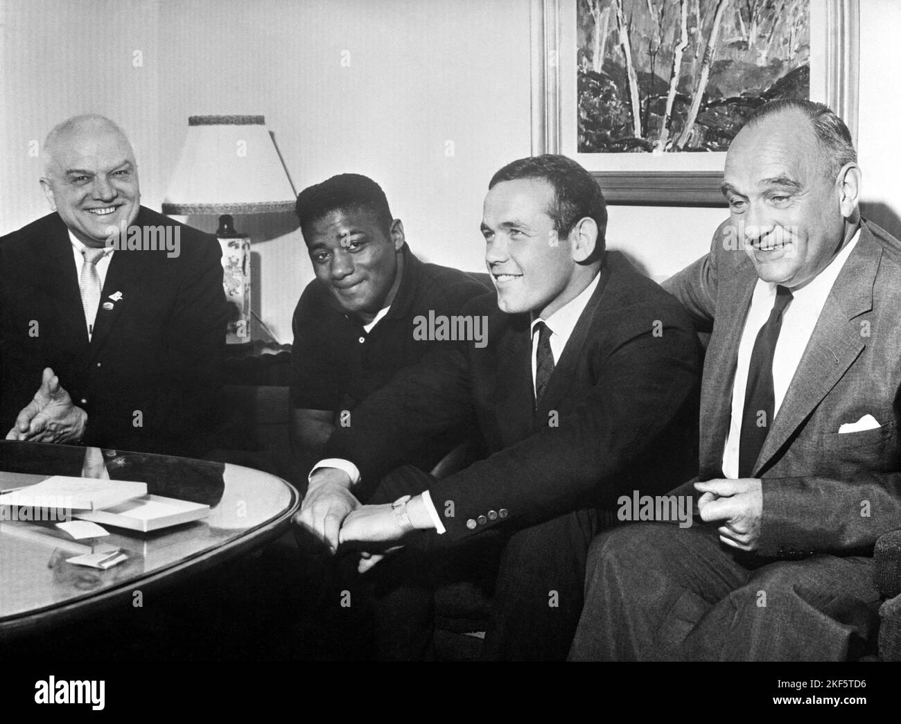 World Heavyweight Champion Floyd Patterson, second left, and his ...