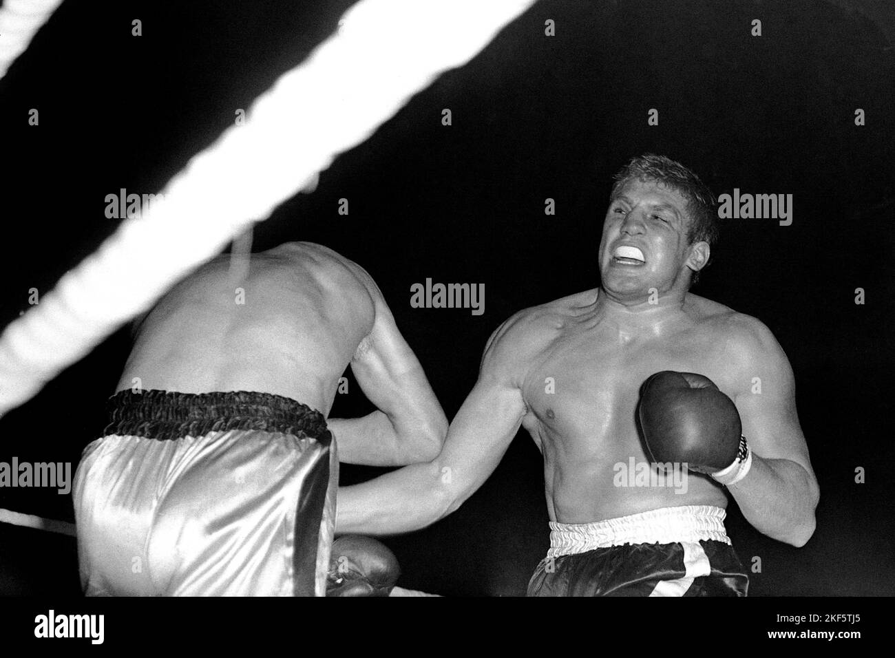 Billy Walker puts everything into a right to Johnny Prescott's body ...