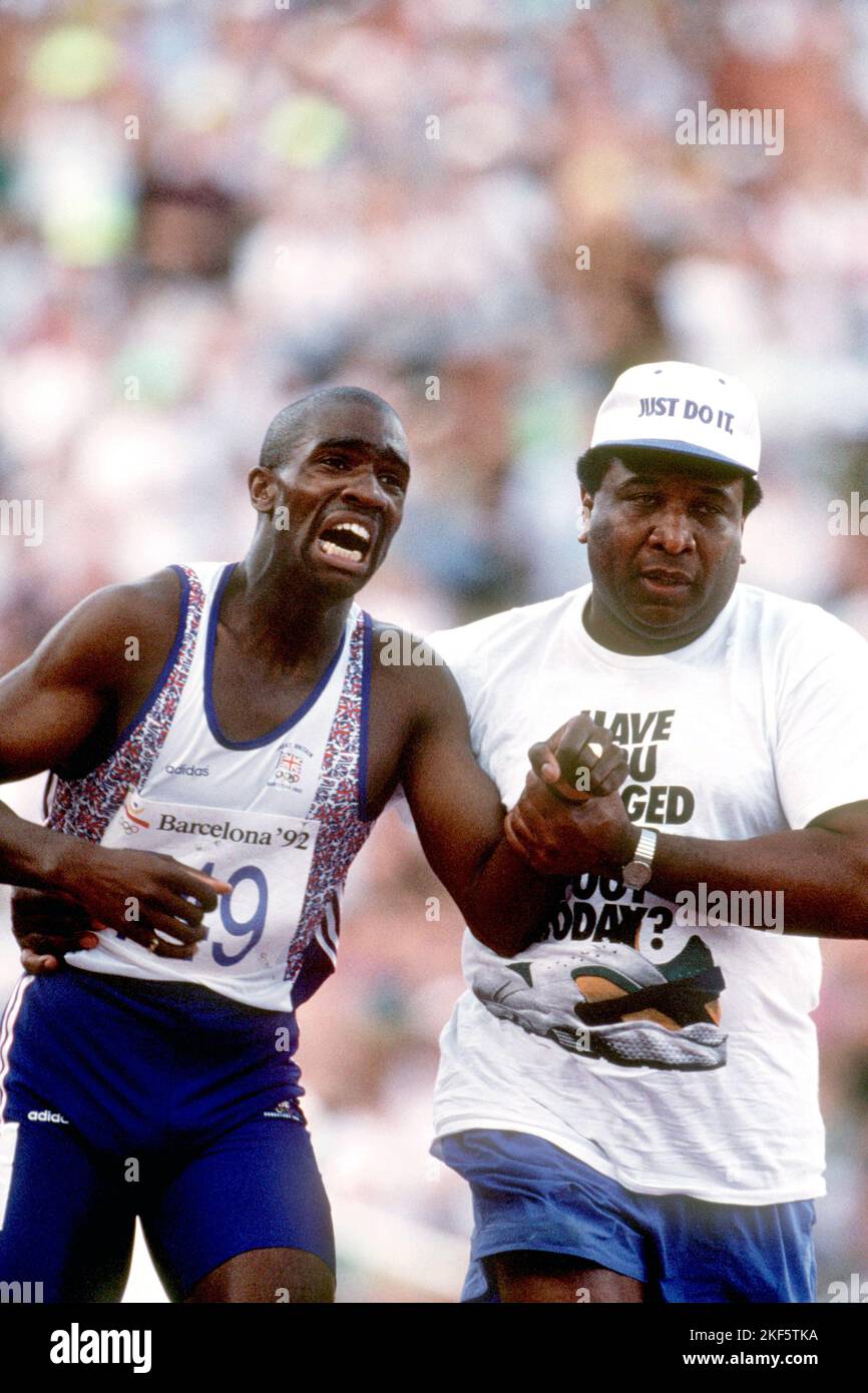Great Britain's Derek Redmond limps to the finish line, helped by his ...