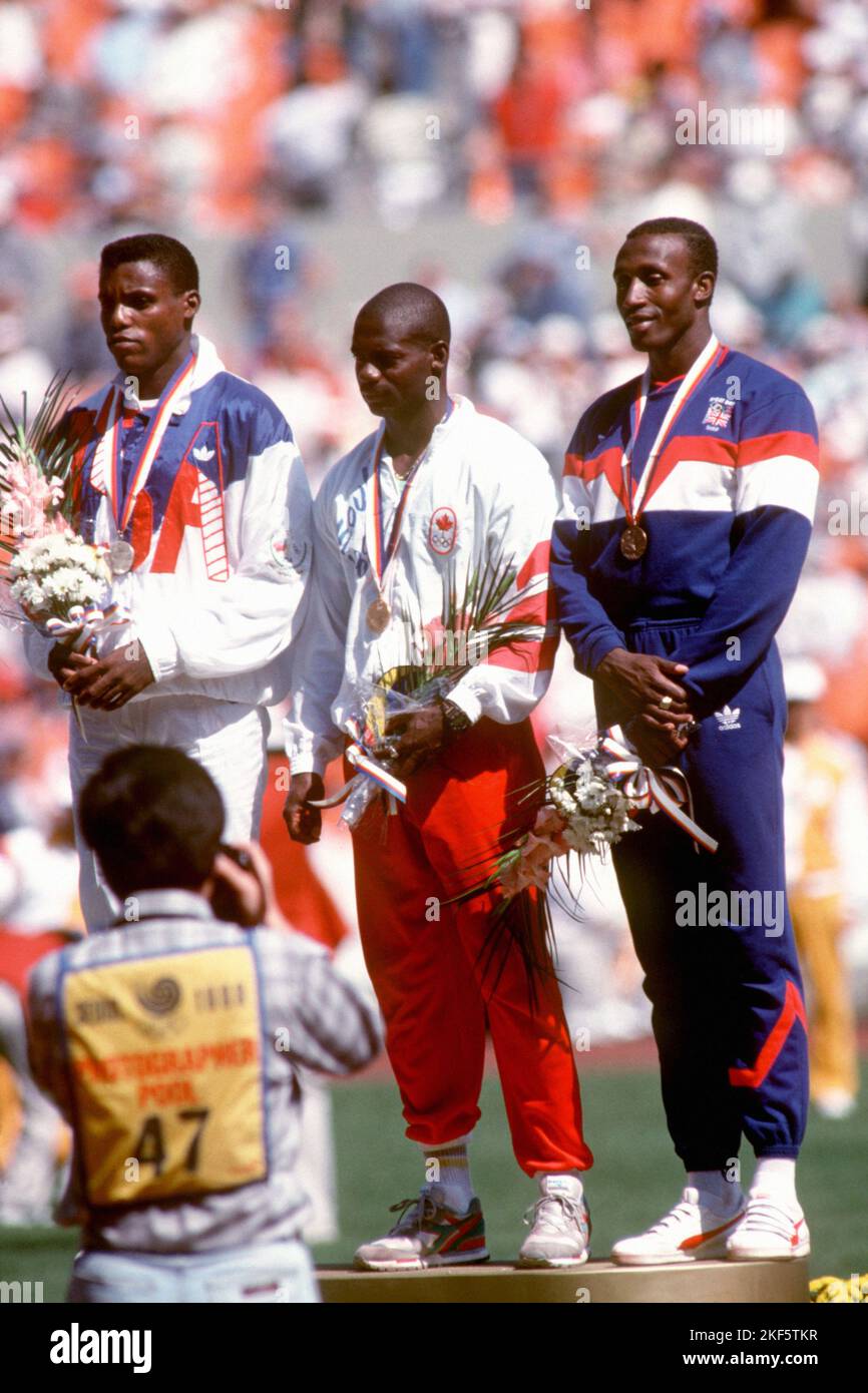 USA's Carl Lewis (l, silver) appears annoyed to have lost gold to ...