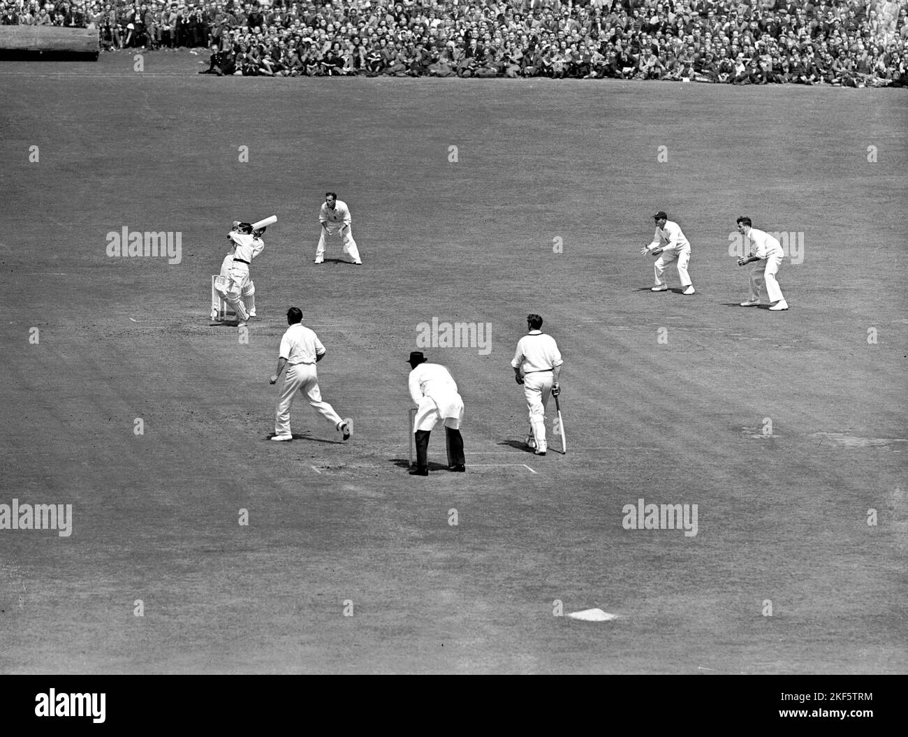 Australia's Neil Harvey (l) pulls England's Kenneth Cranston (second l ...