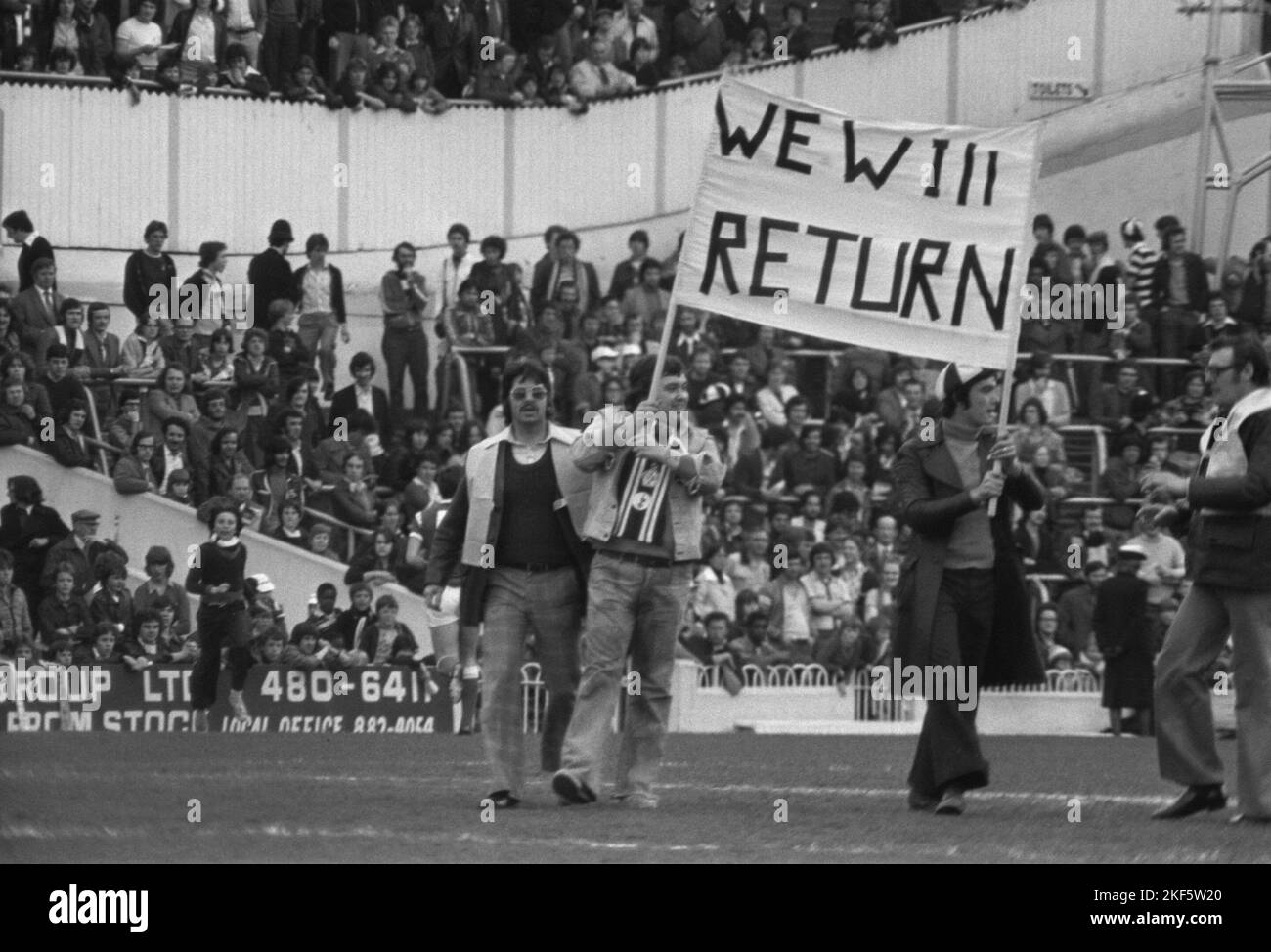 Tottenham Supporters March Across The Pitch With A Banner Proclaiming A