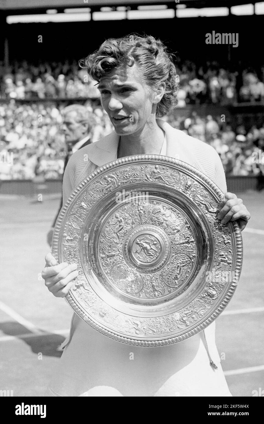 Shirley Fry poses with the trophy after beating Angela Buxton in ...