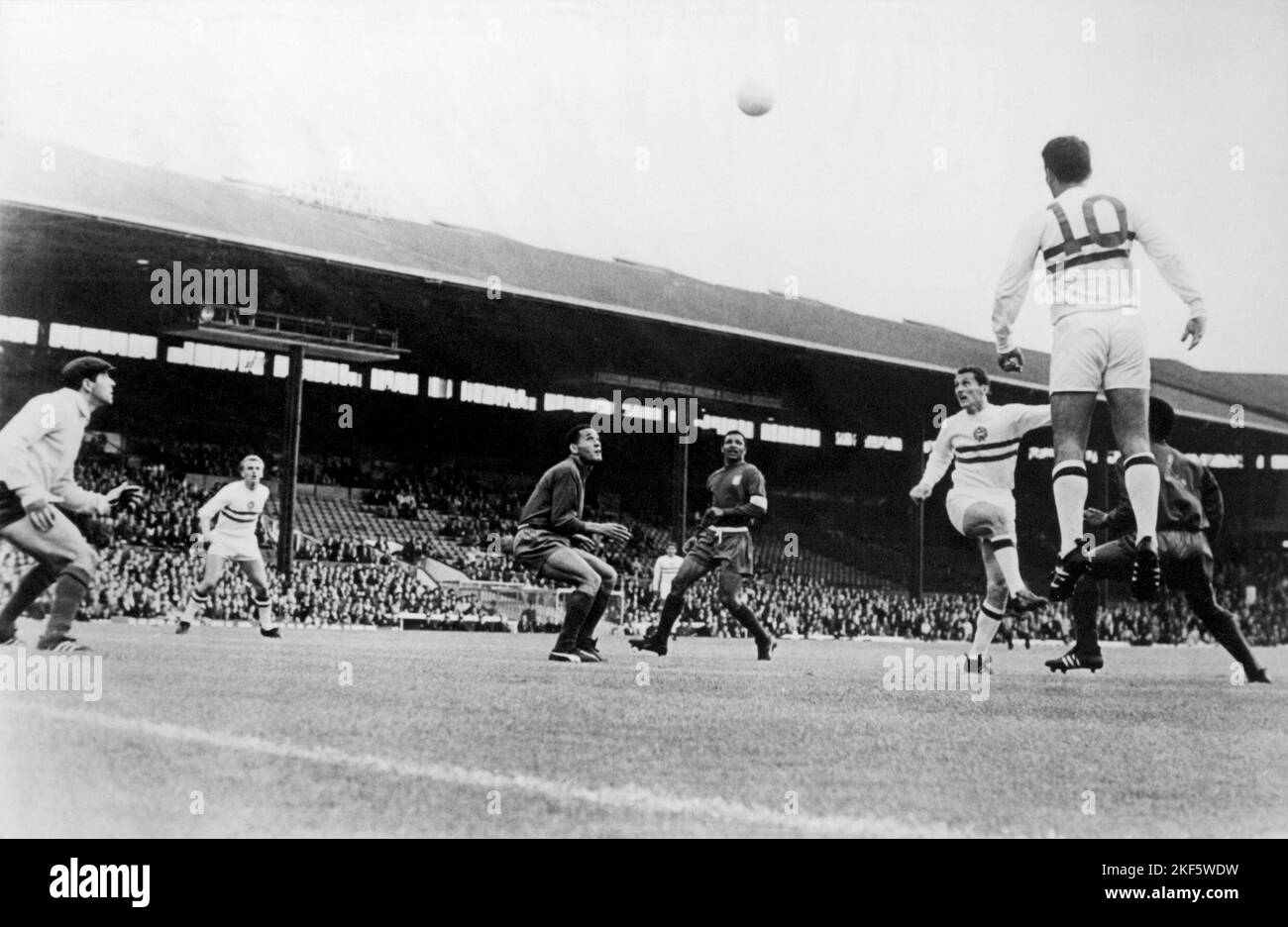 Hungary's Florian Albert (third r) directs a header goalwards, watched ...