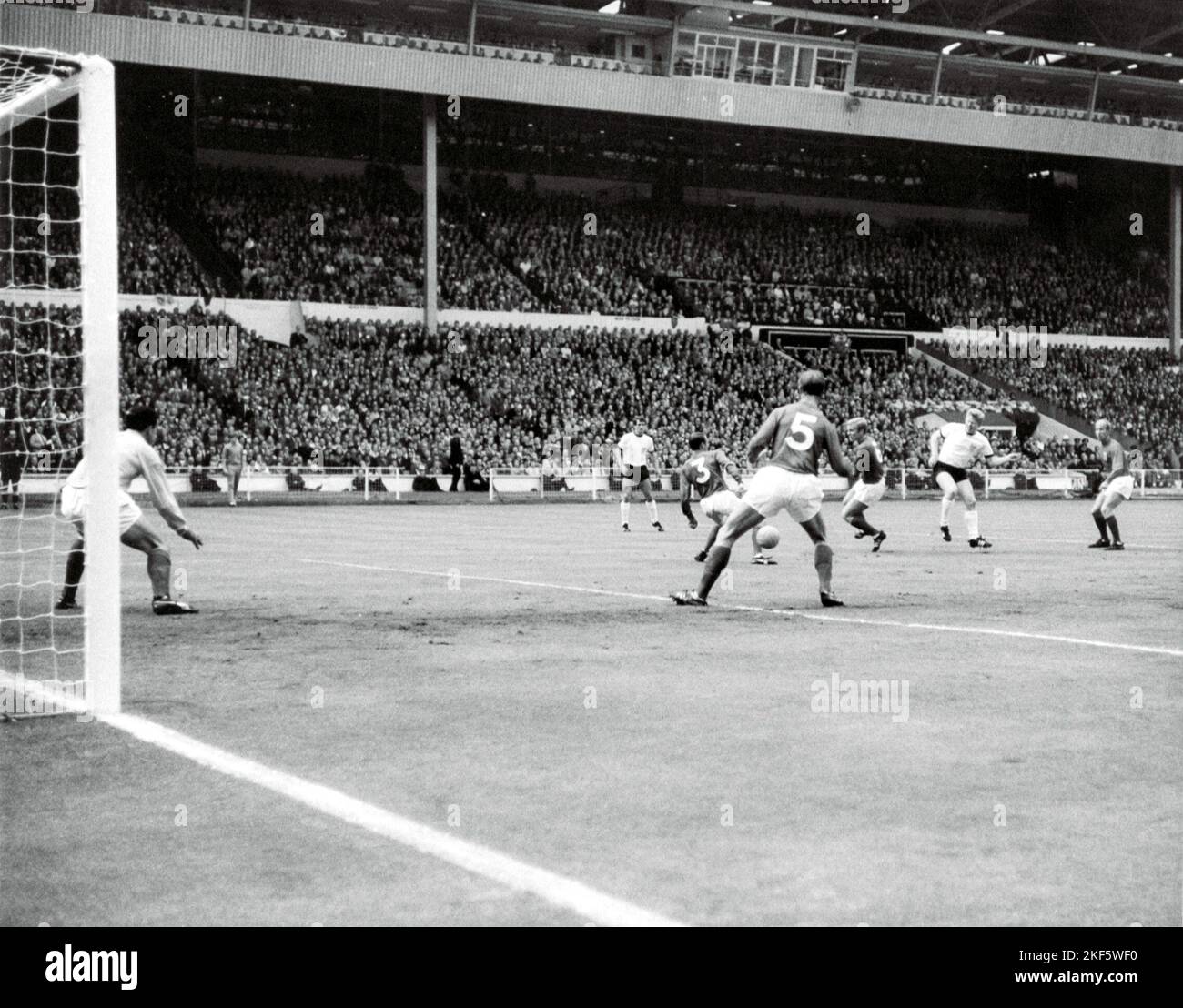 West Germany's Helmut Haller (second r) fires home the opening goal ...