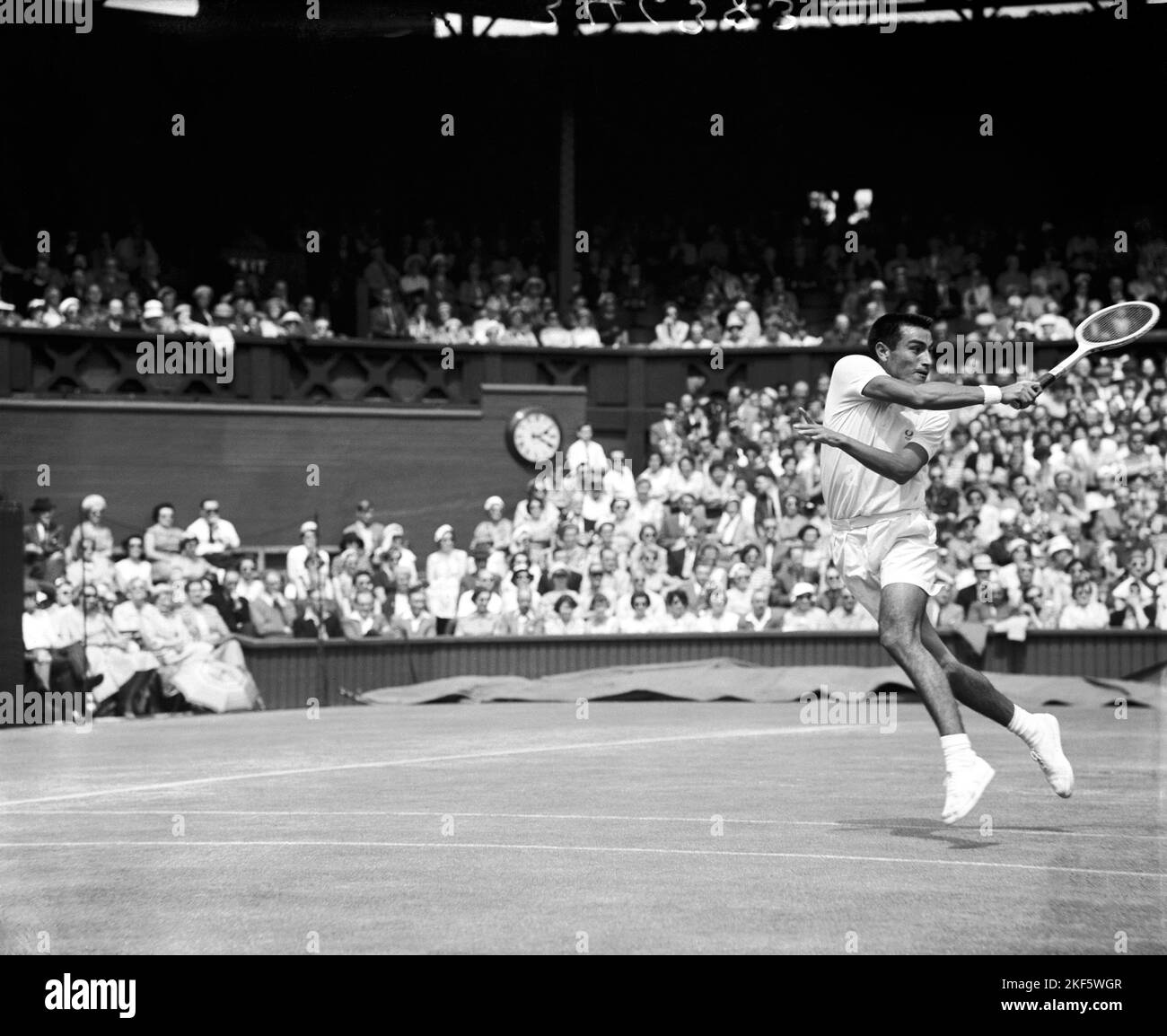 Alex Olmedo in action during his quarter final match against Luis Ayala ...