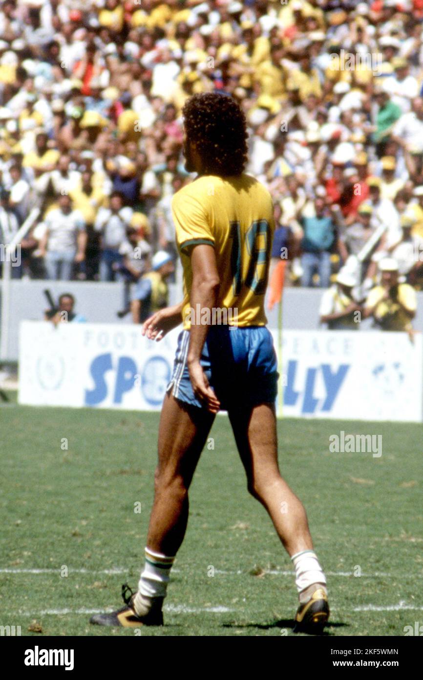 Brazil's Socrates trudges back to the centre circle after missing his ...
