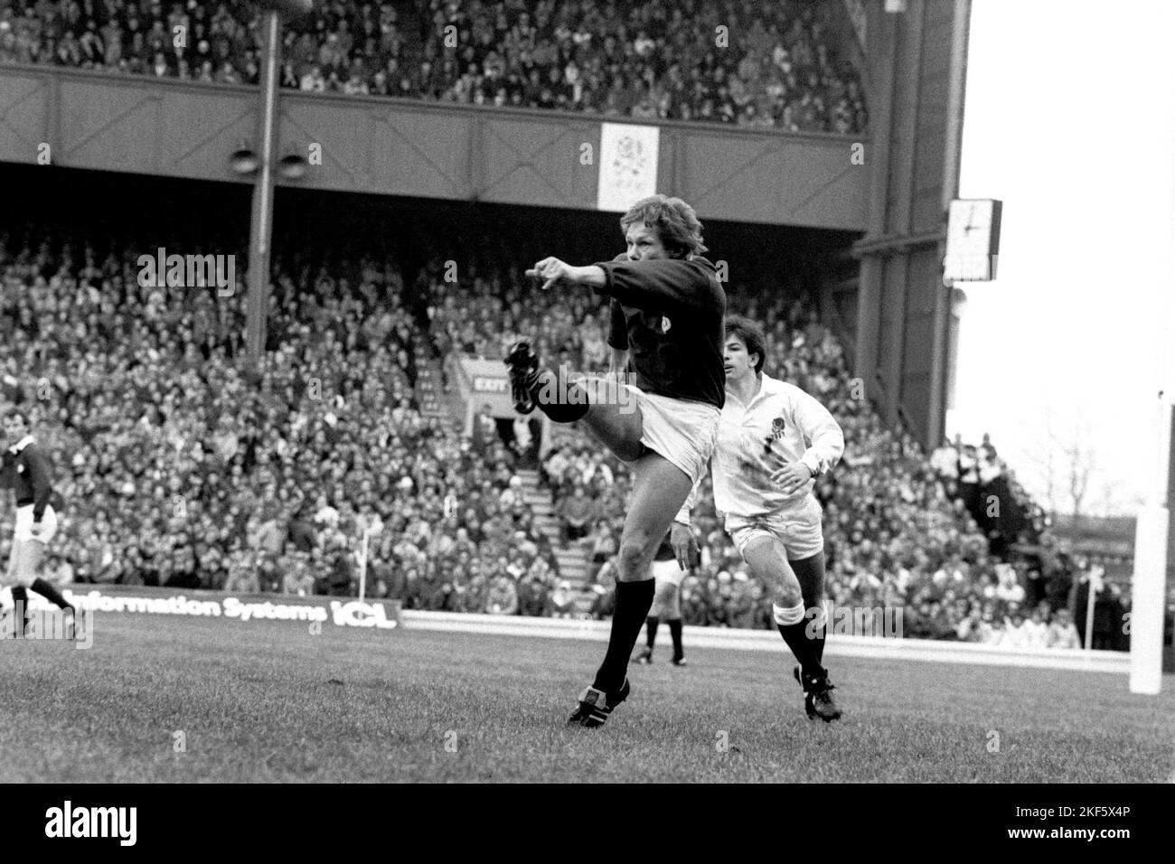 Scotland's John Rutherford kicks to touch Stock Photo - Alamy