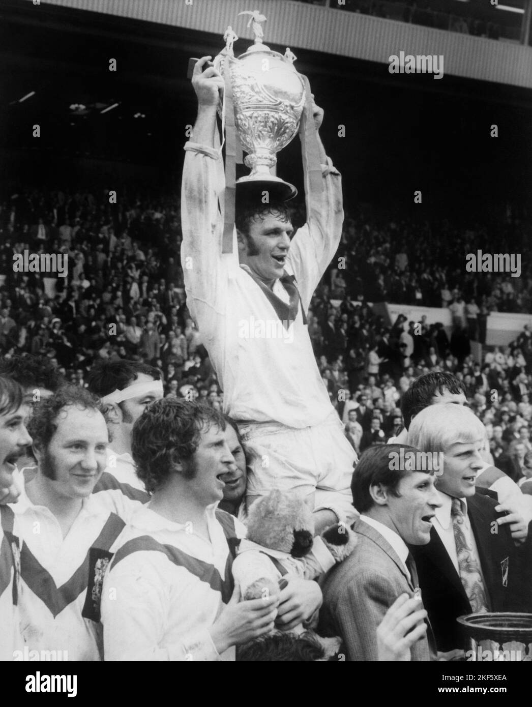 Kel Coslett the St Helens captain is lifted high with the trophy by ...