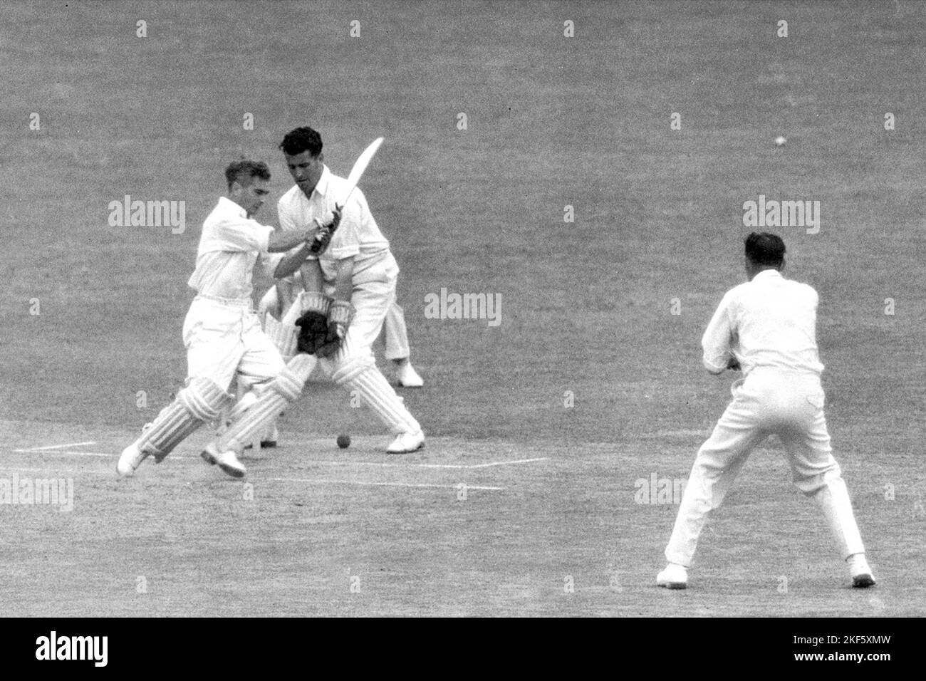 Kent's Tony Pawson (l) mistimes a pull, watched by Middlesex ...