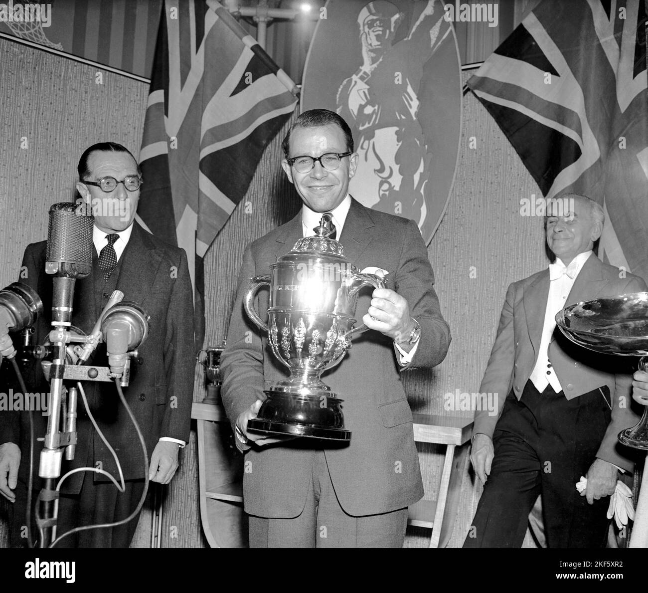 Chris Brasher receives the Sportsman of the Year Trophy from S.W Lionel ...