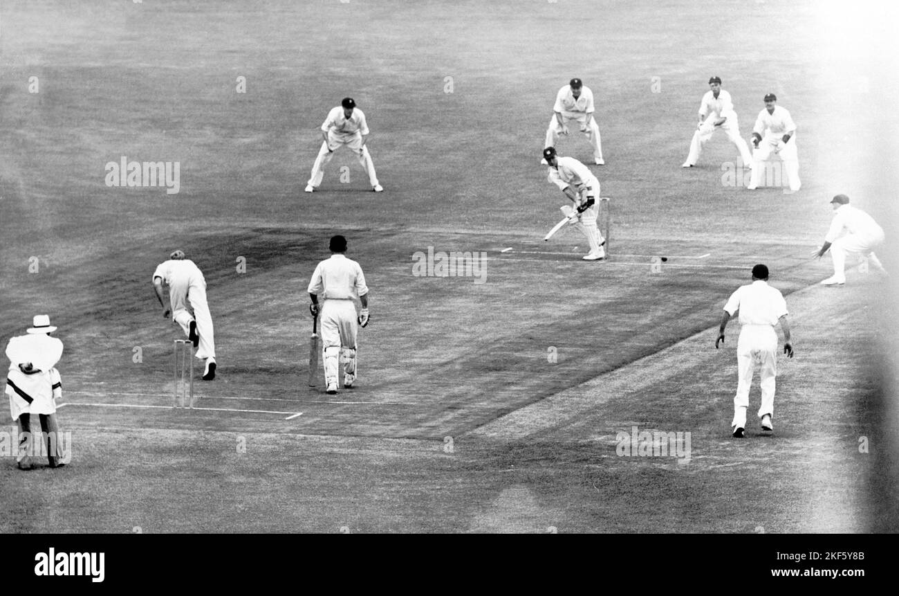 England's Len Hutton (c) nudges a ball from South Africa's Cuan ...