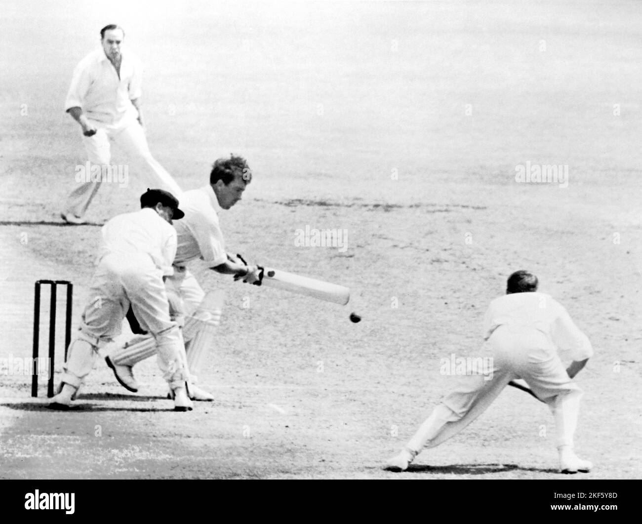 England's Denis Compton (third l) chases a ball outside off-stump ...