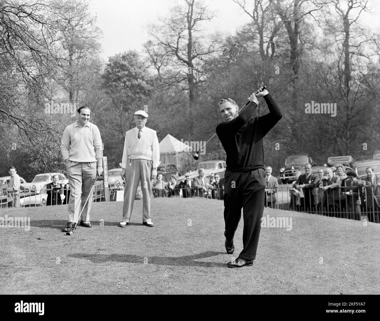 Harry Weetman (r) drives, watched by Peter Mills (l) and official Hugh ...