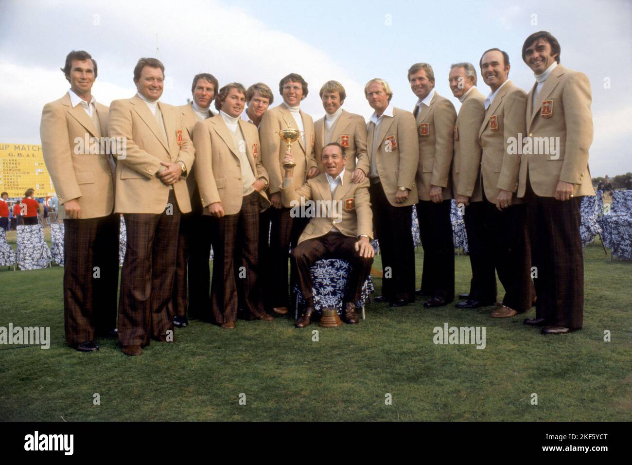 USA captain Dow Finsterwald (c) holds the Ryder Cup aloft as his ...