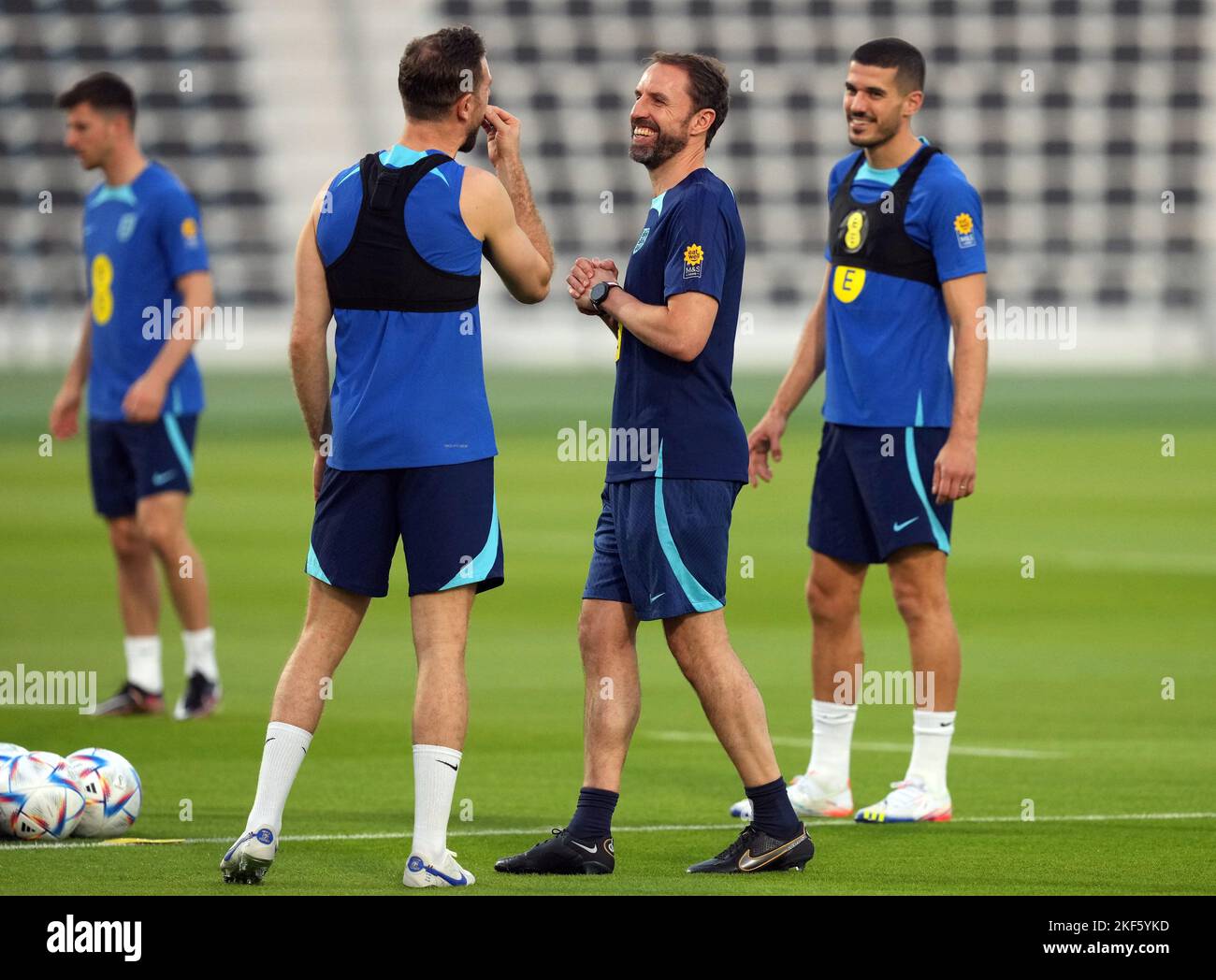 England's Jordan Henderson shares a joke with manager Gareth Southgate ...